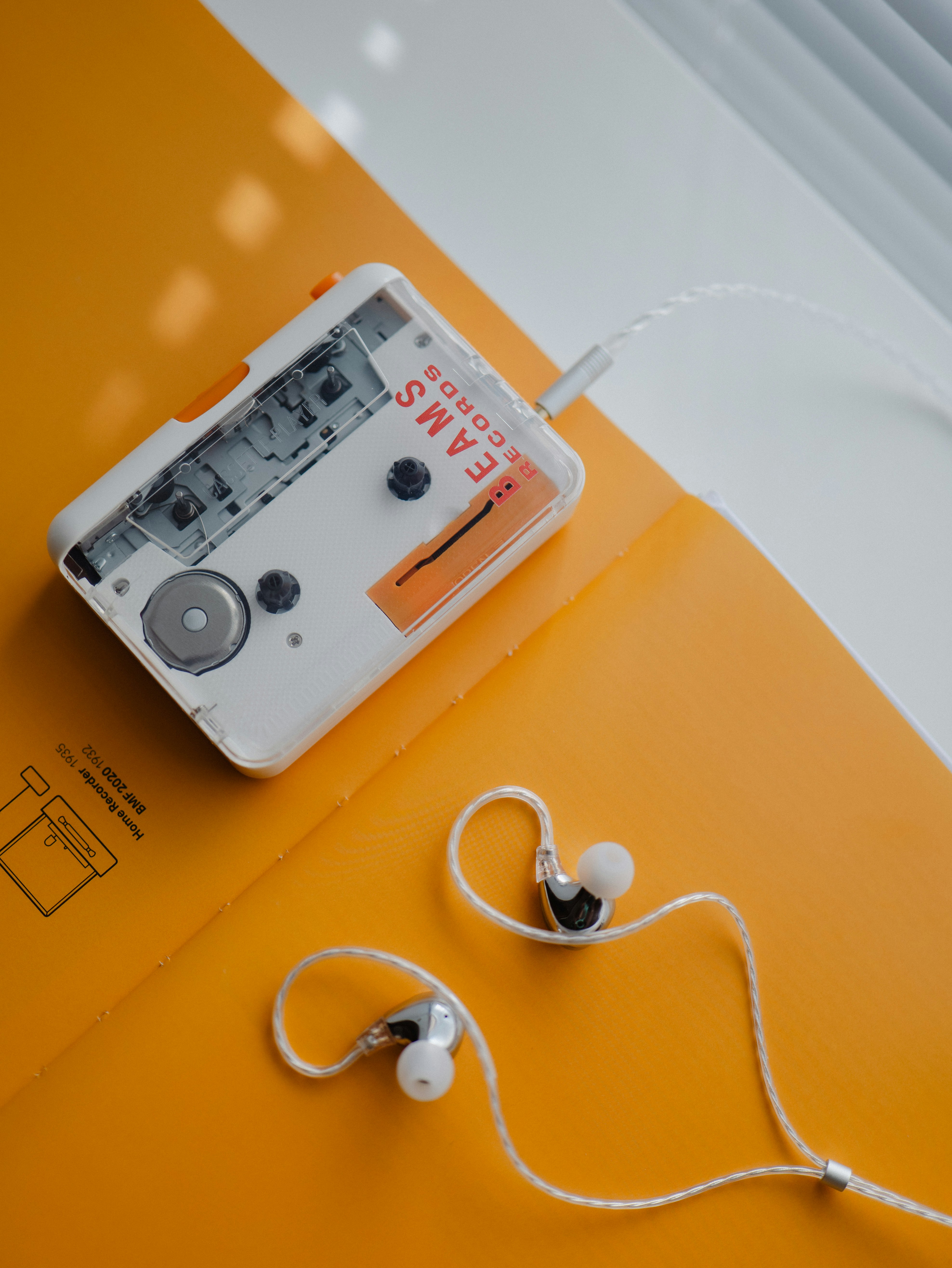 Bright Orange Studio: A Compact Cassette of Earbuds and Wires