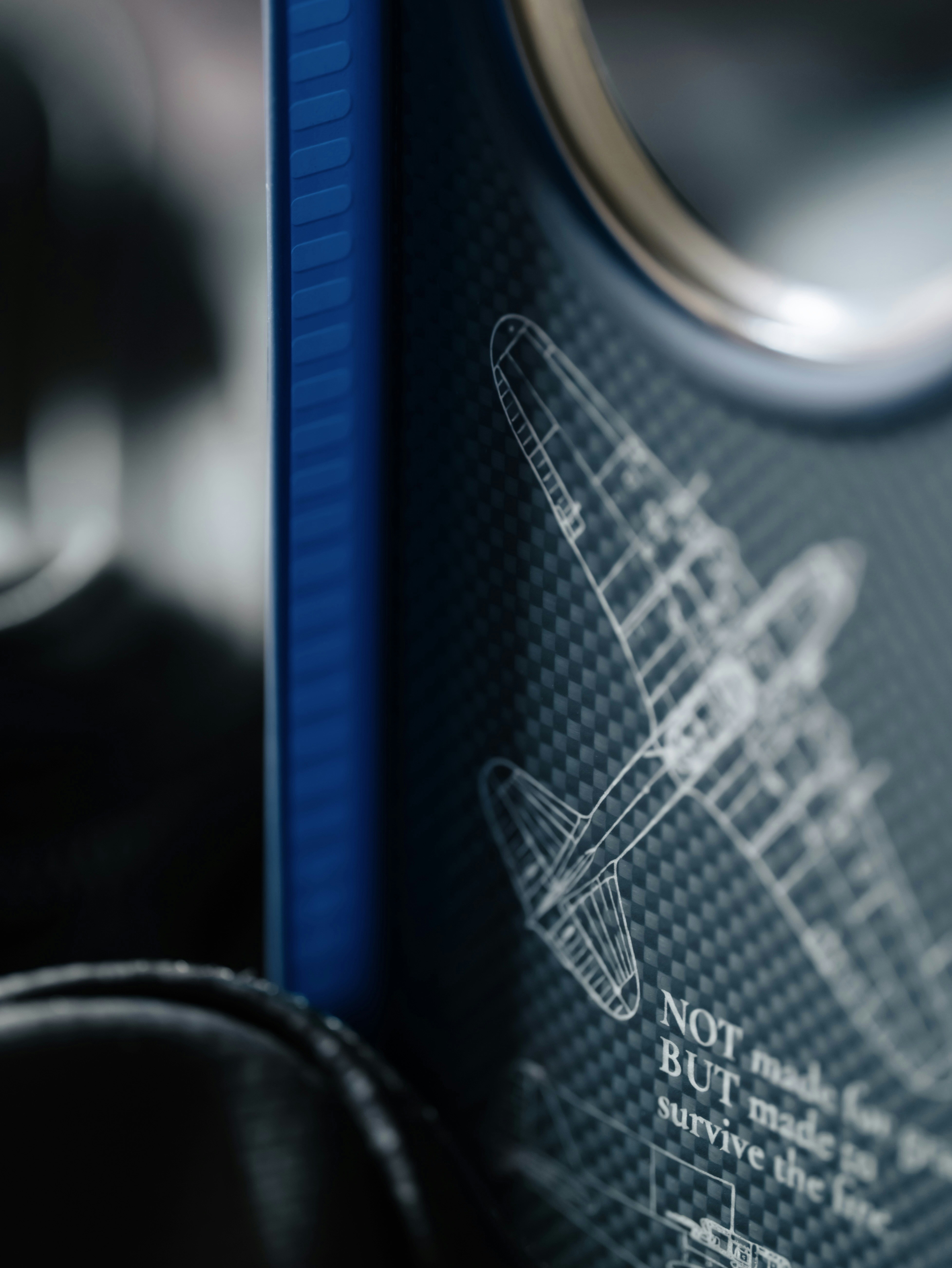 Blueprint in Carbon Fiber: A Close-Up of the Aircraft Diagram on a Vintage Camera Body