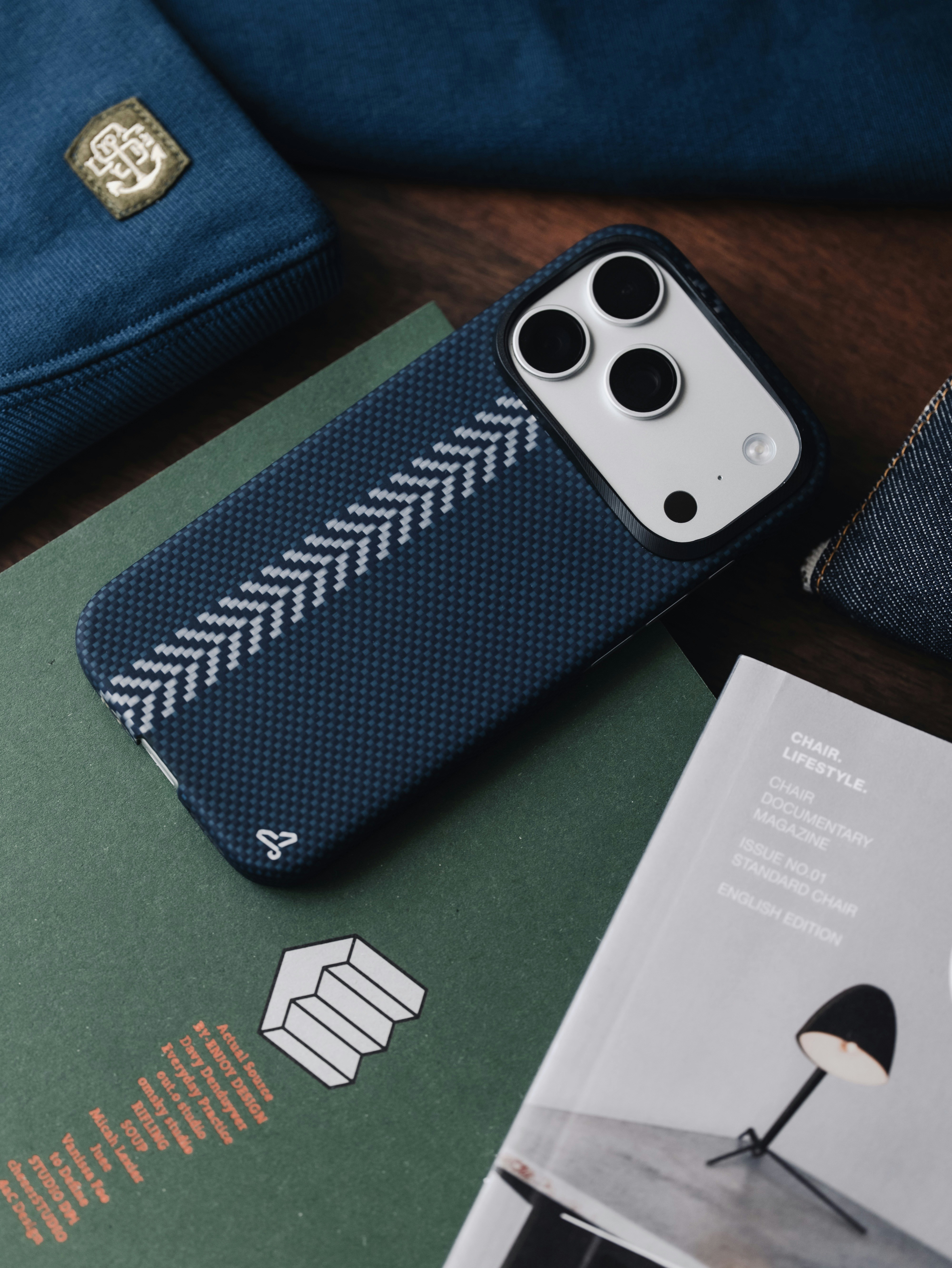 Dark blue phone case with white chevron pattern.