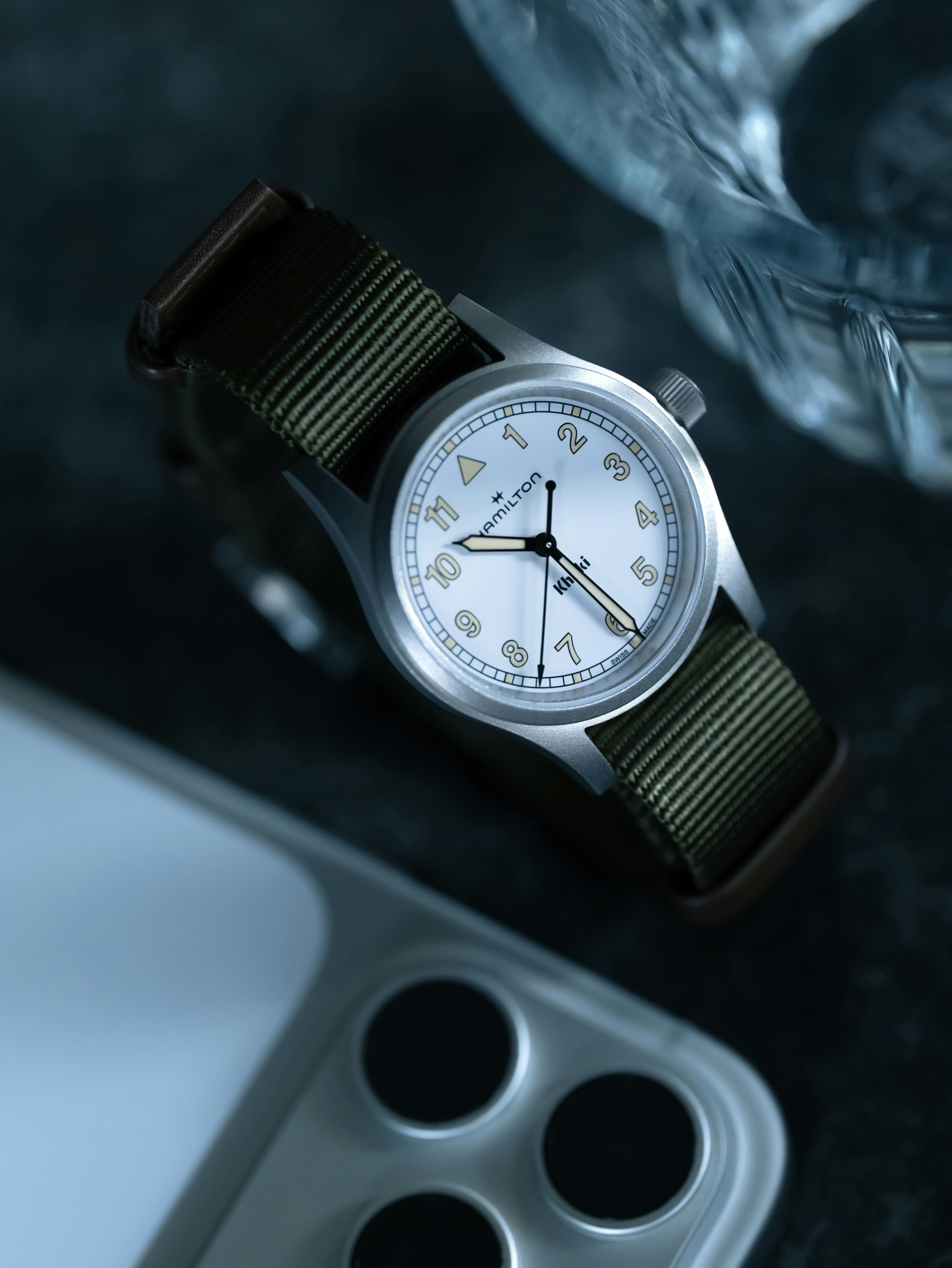 Rugged Field Watch Resting on a Marble Surface