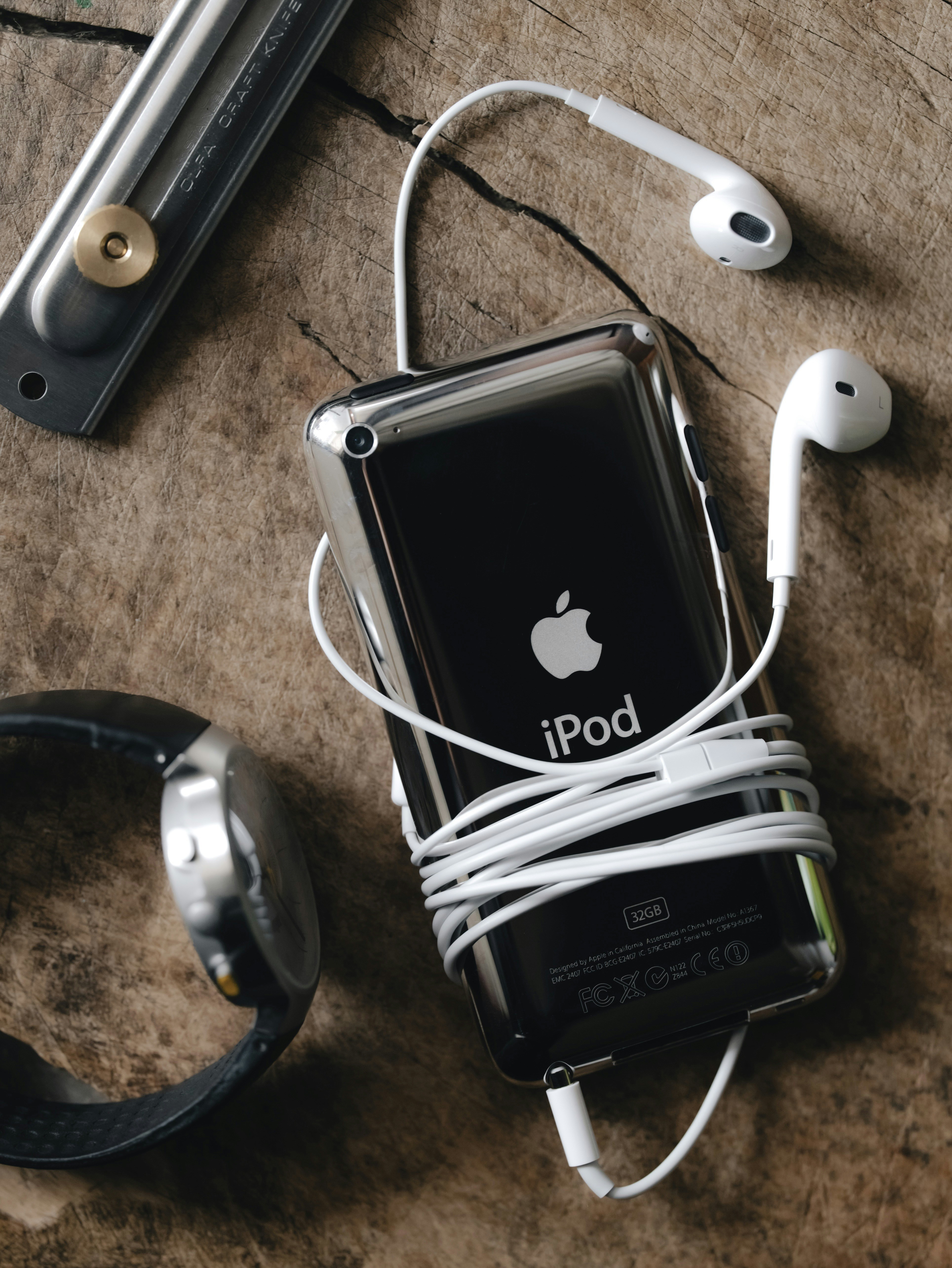 Glossy iPod Heritage: Wires, Glass, and Apple Logo Centerpiece