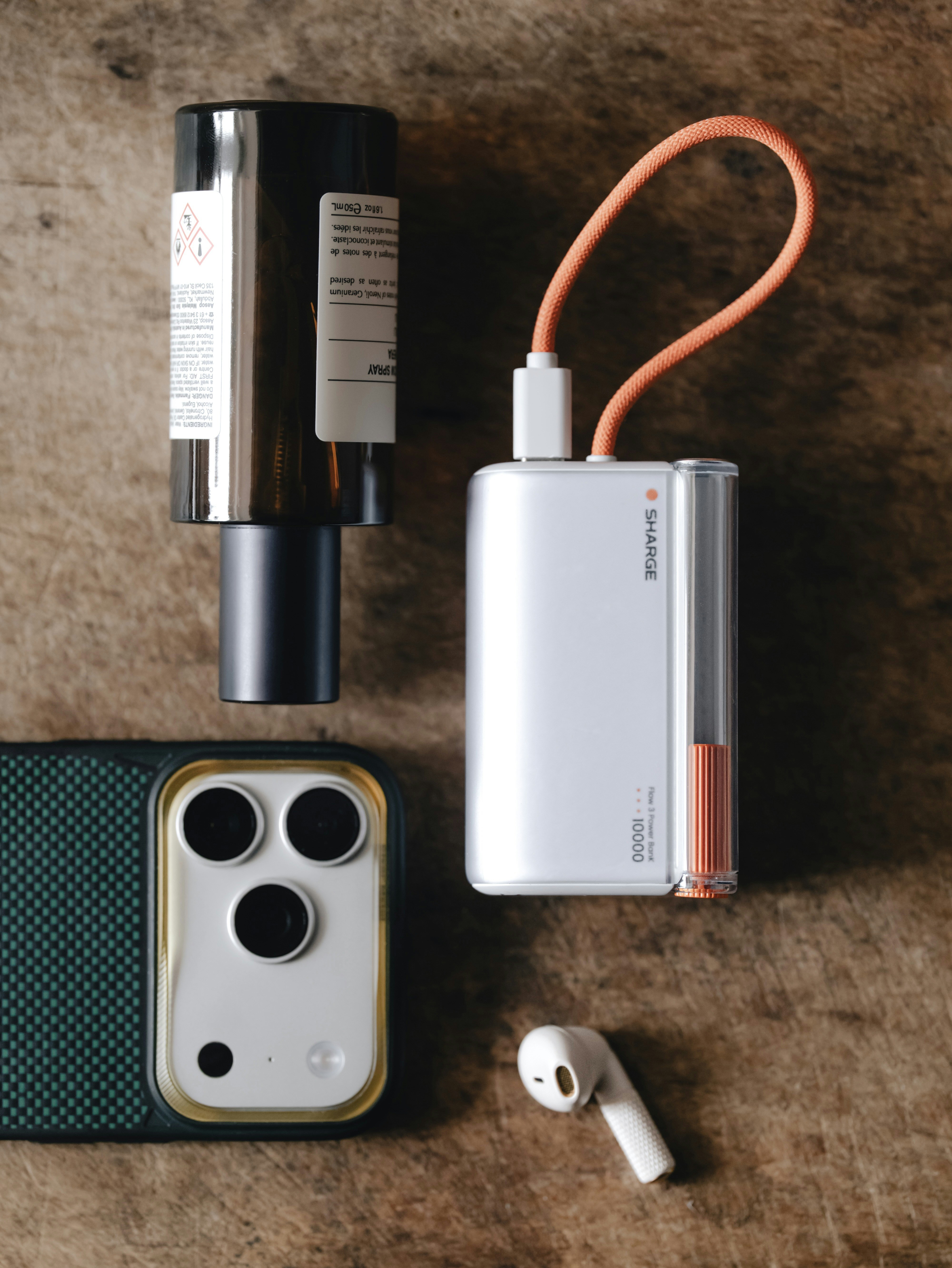 Compact Power Hub: A Trio of Essentials on a Rustic Surface