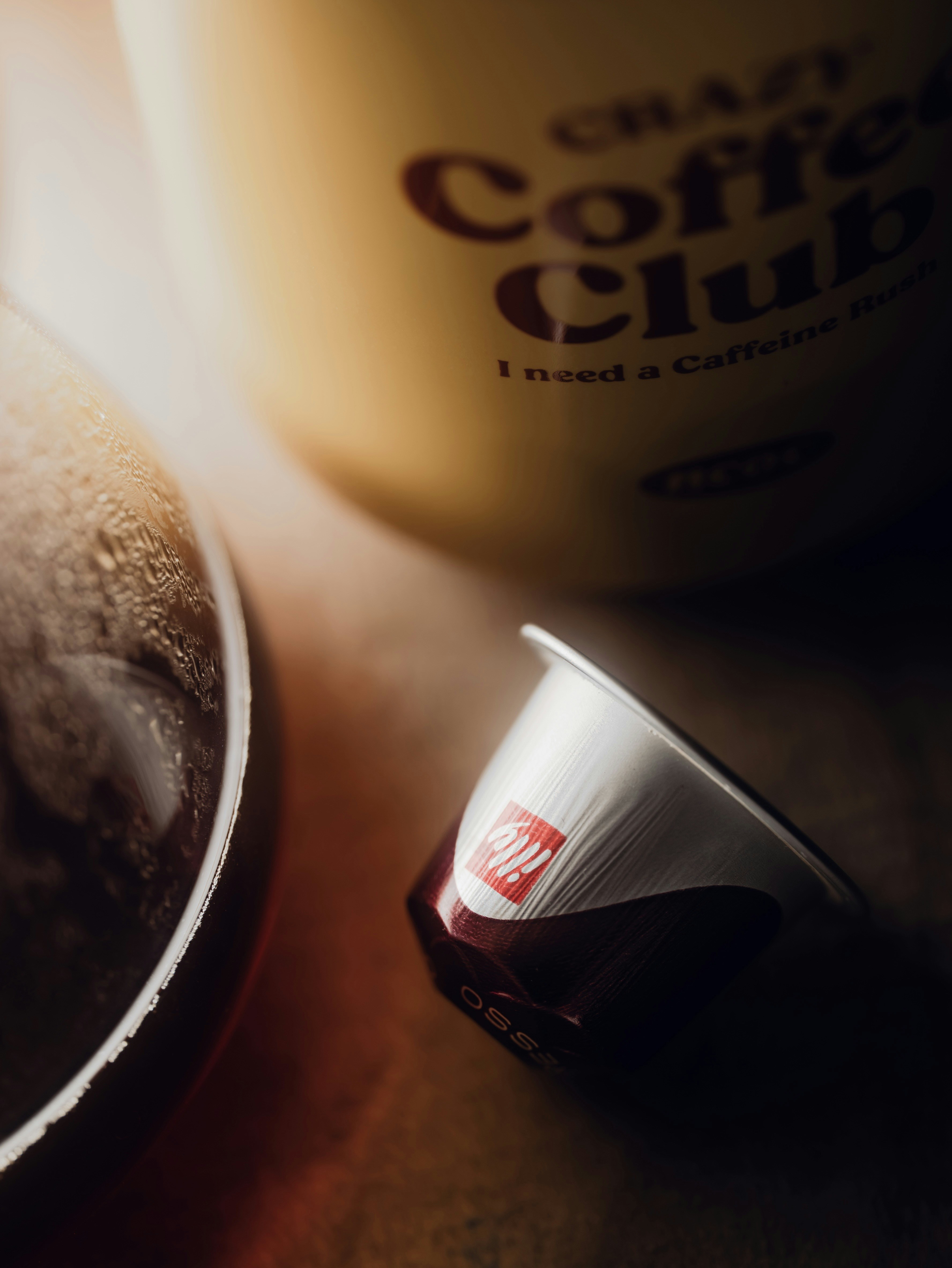 Blurred Brew: A Close-Up of a Cup and Lid on a Rich Surface