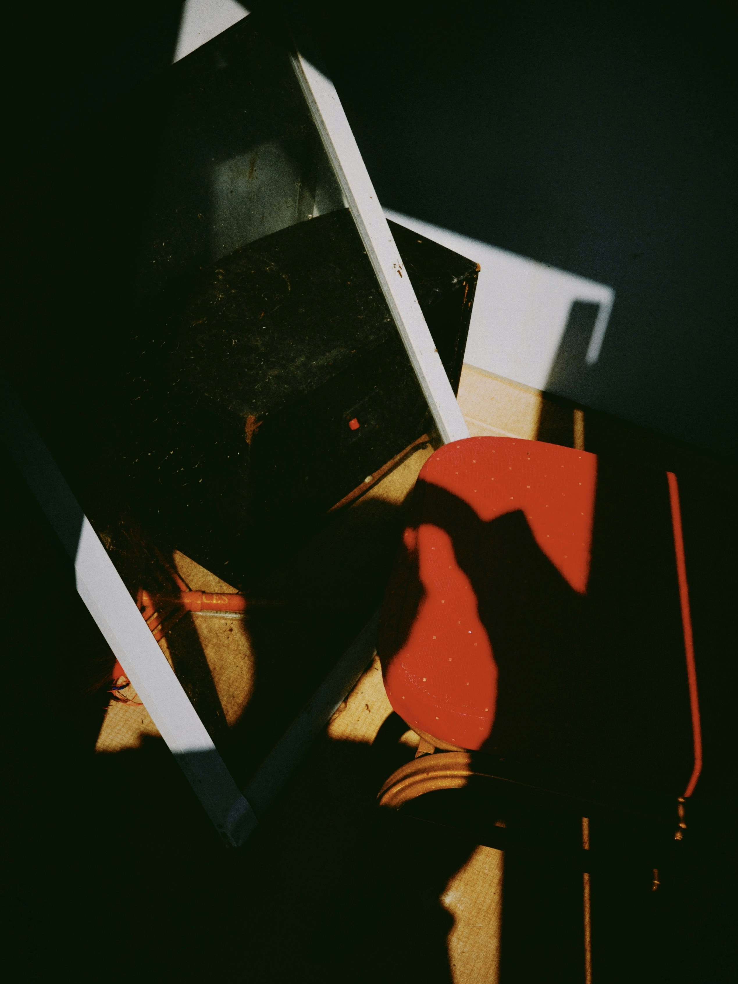 Shadowed Reflections: A Geometric Assembly in Red and Black