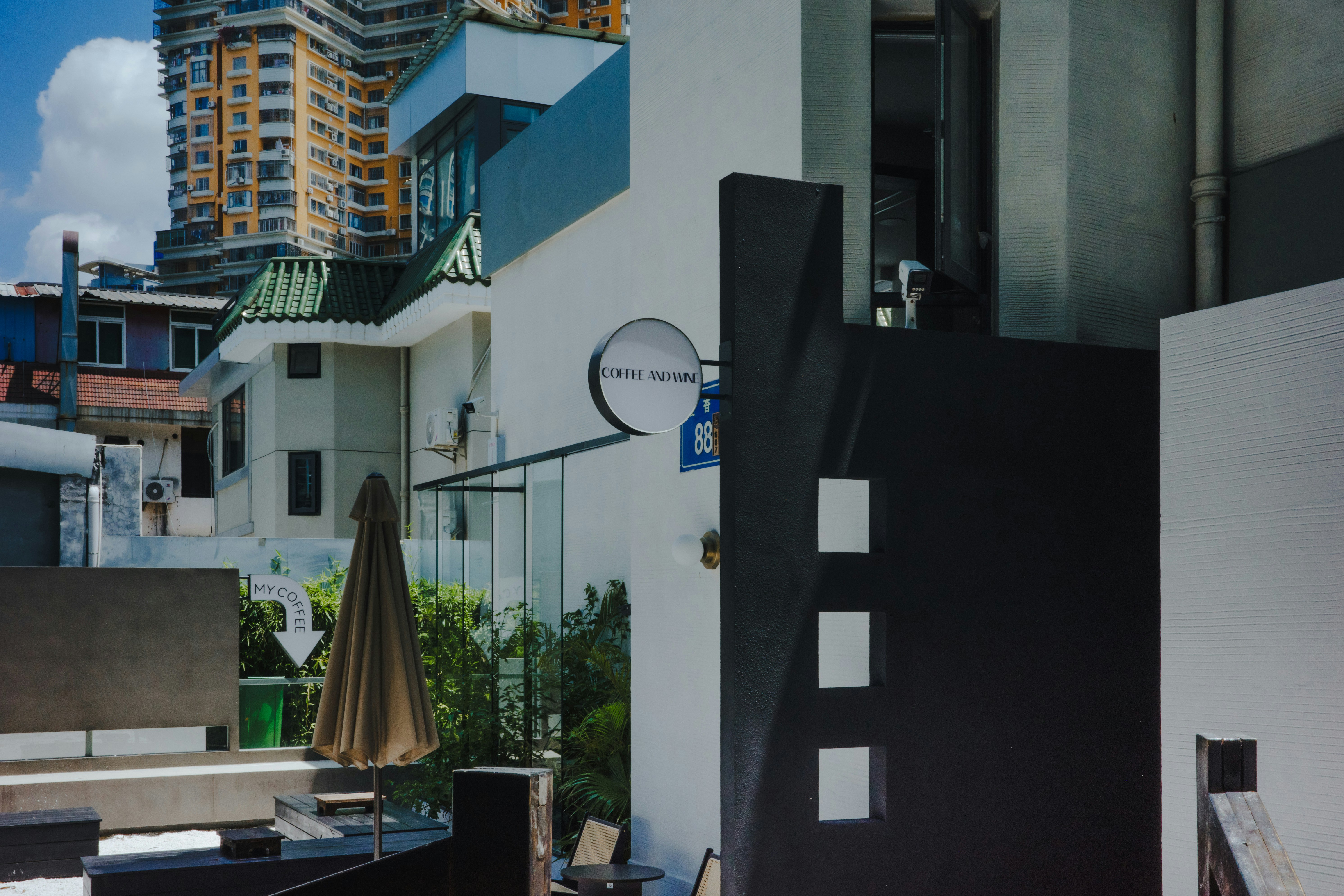 Urban Patio with Modern Facade and Circular Sign