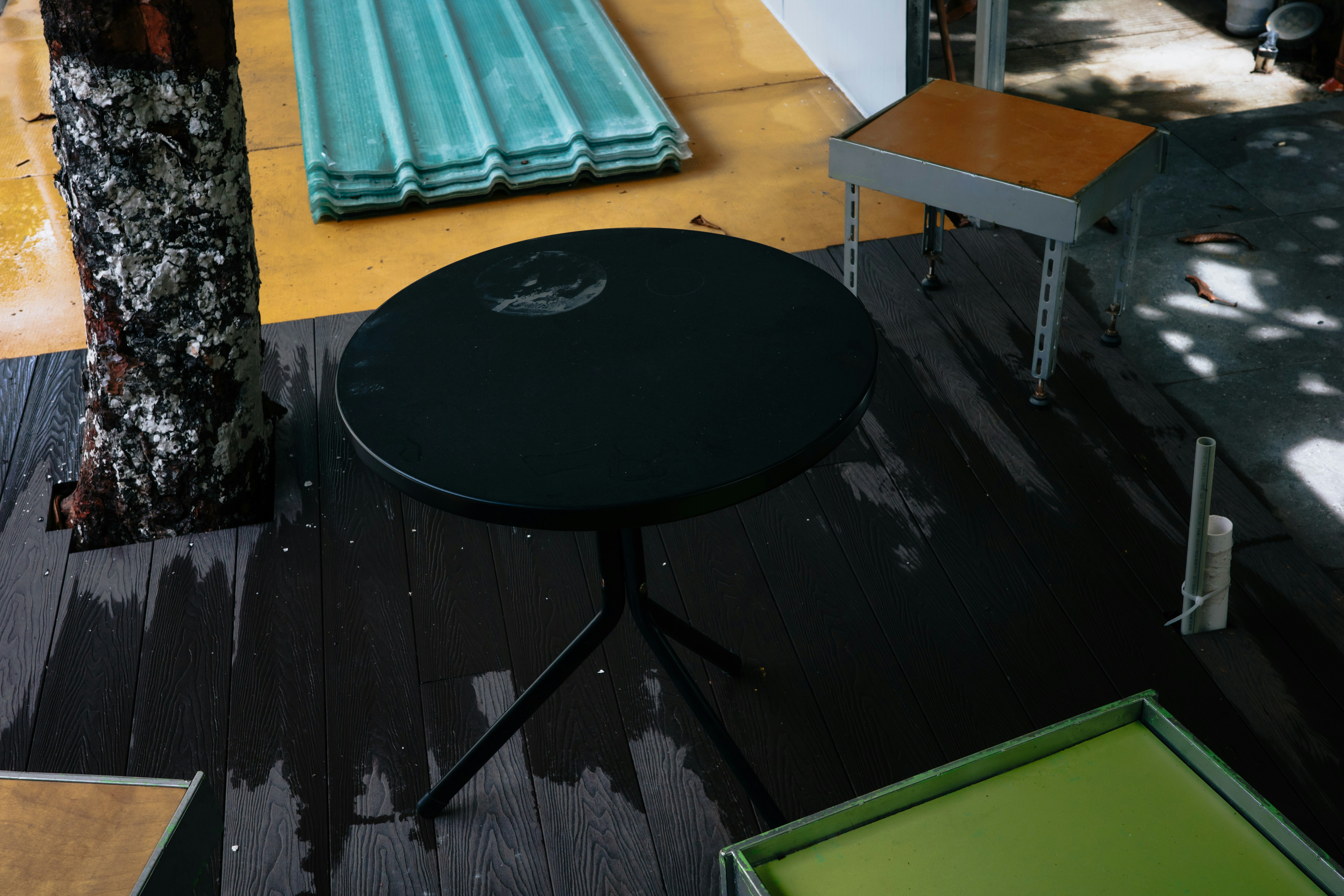Shadowed Terrace at a Quiet Café Corner