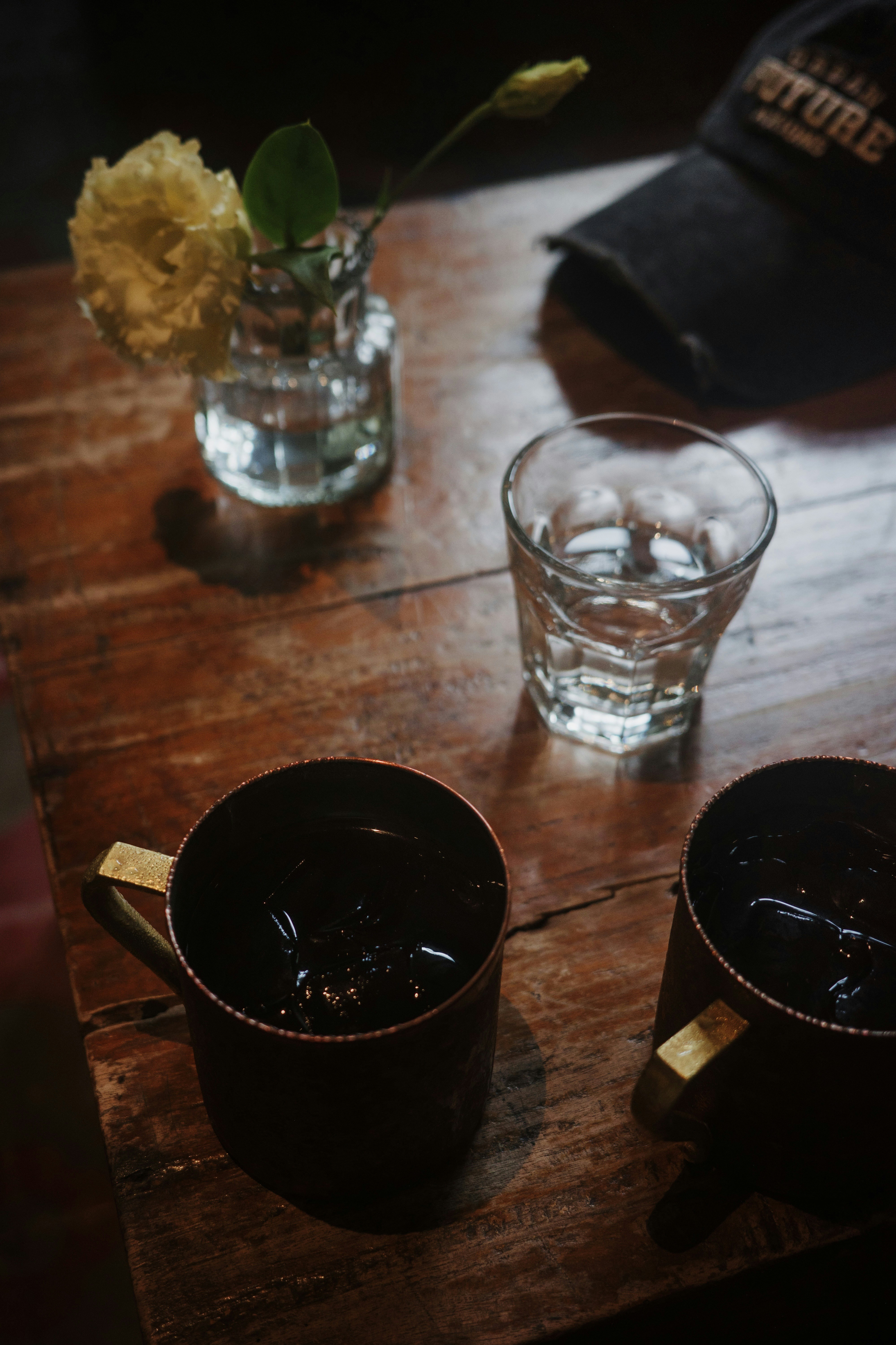 Coffee steam and secrets on a rustic wooden table