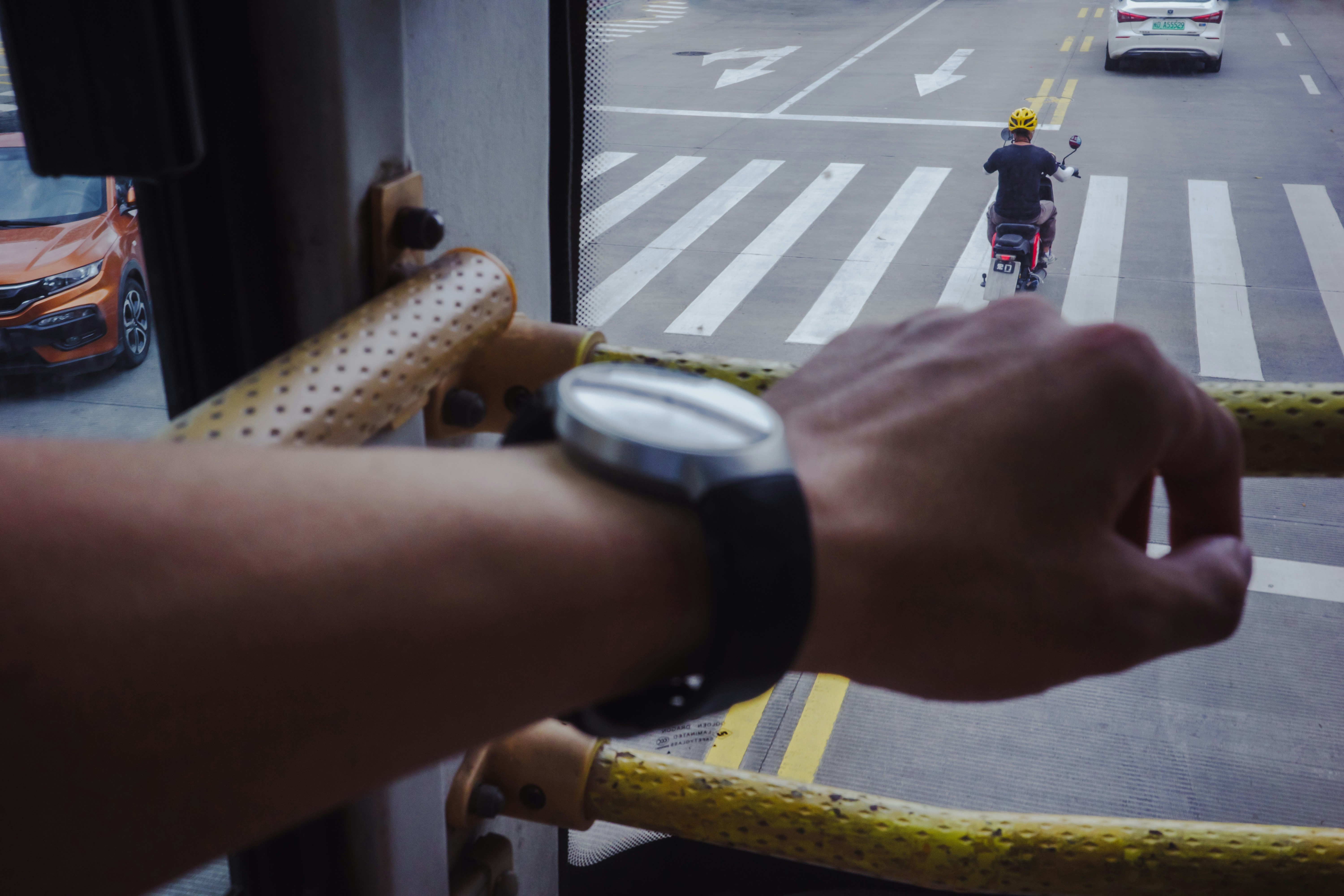Person wearing a fitness tracker on their wrist.