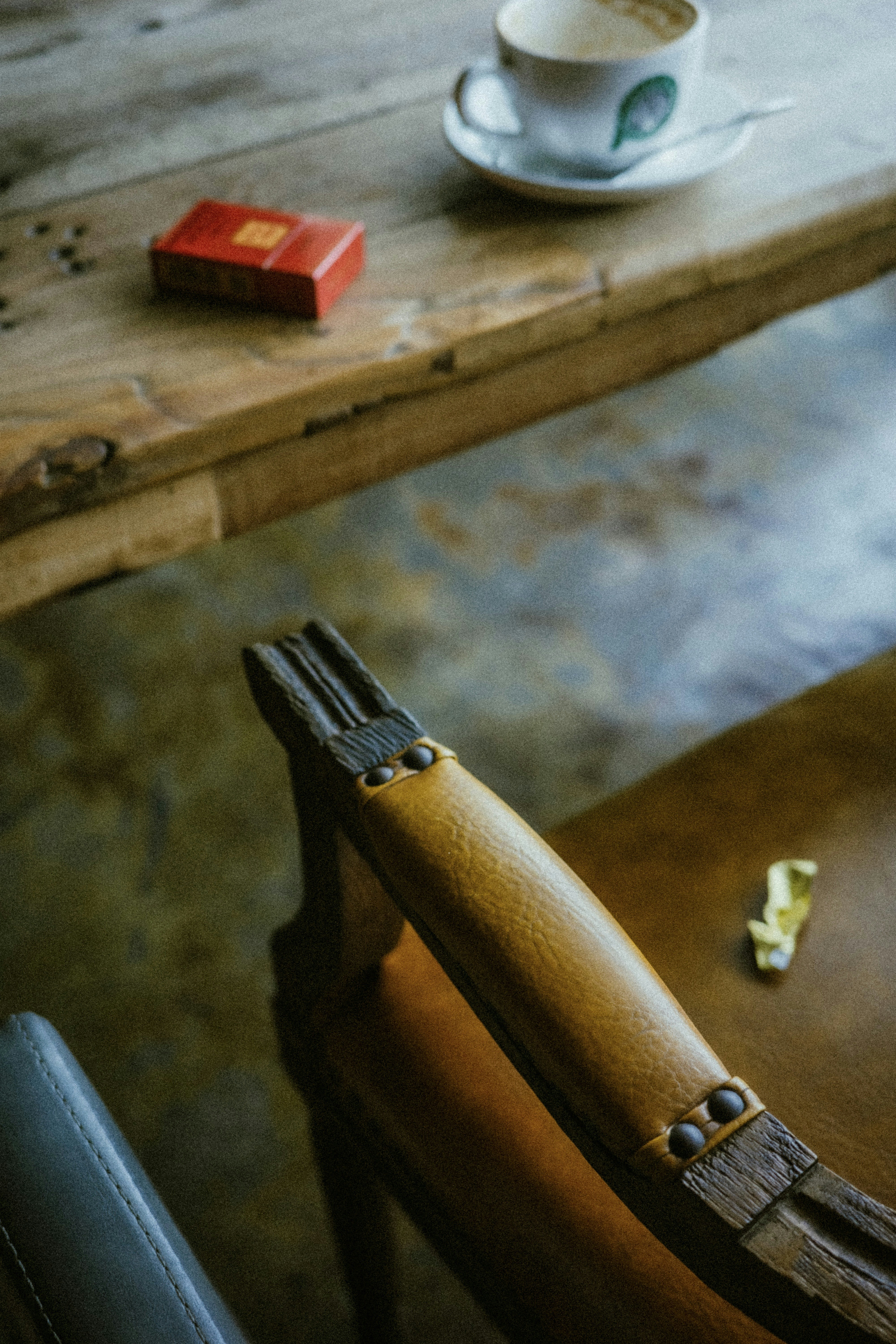 Leather chair and wooden table in a cozy cafe scene