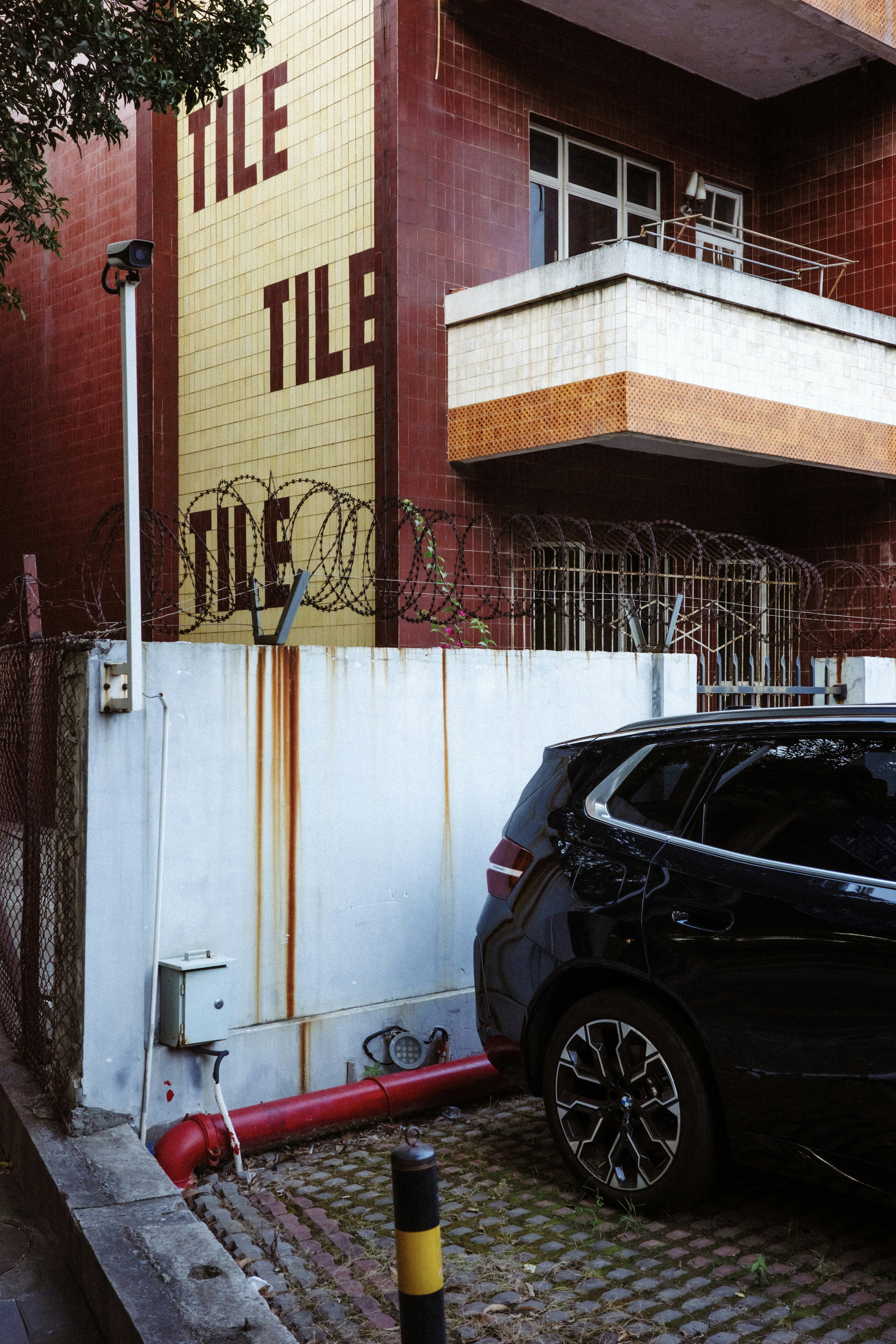 Urban Echoes: The Tile, The Barbed Fence, and The Black SUV