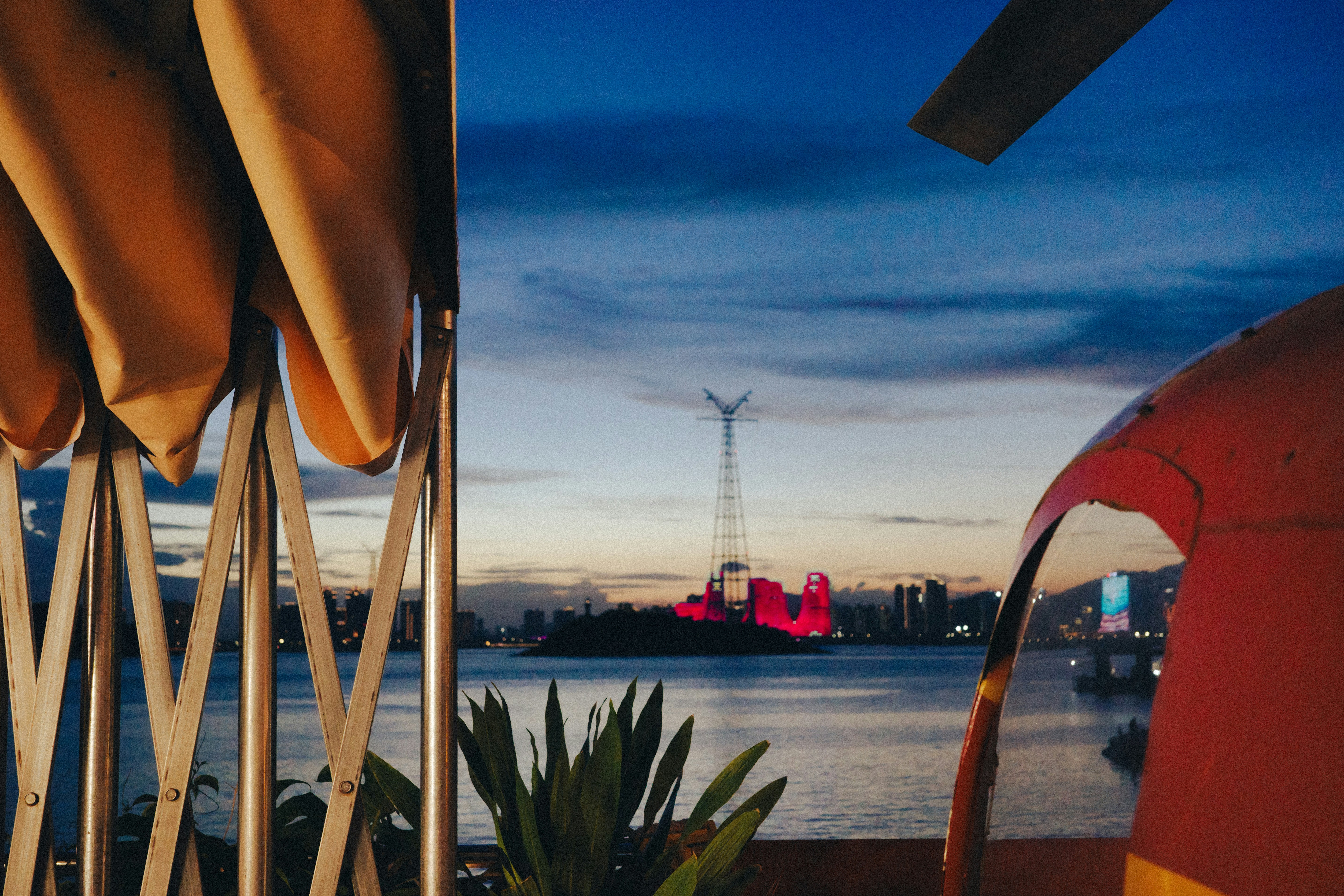 Sunset Over a City Skyline From a Hidden Balcony