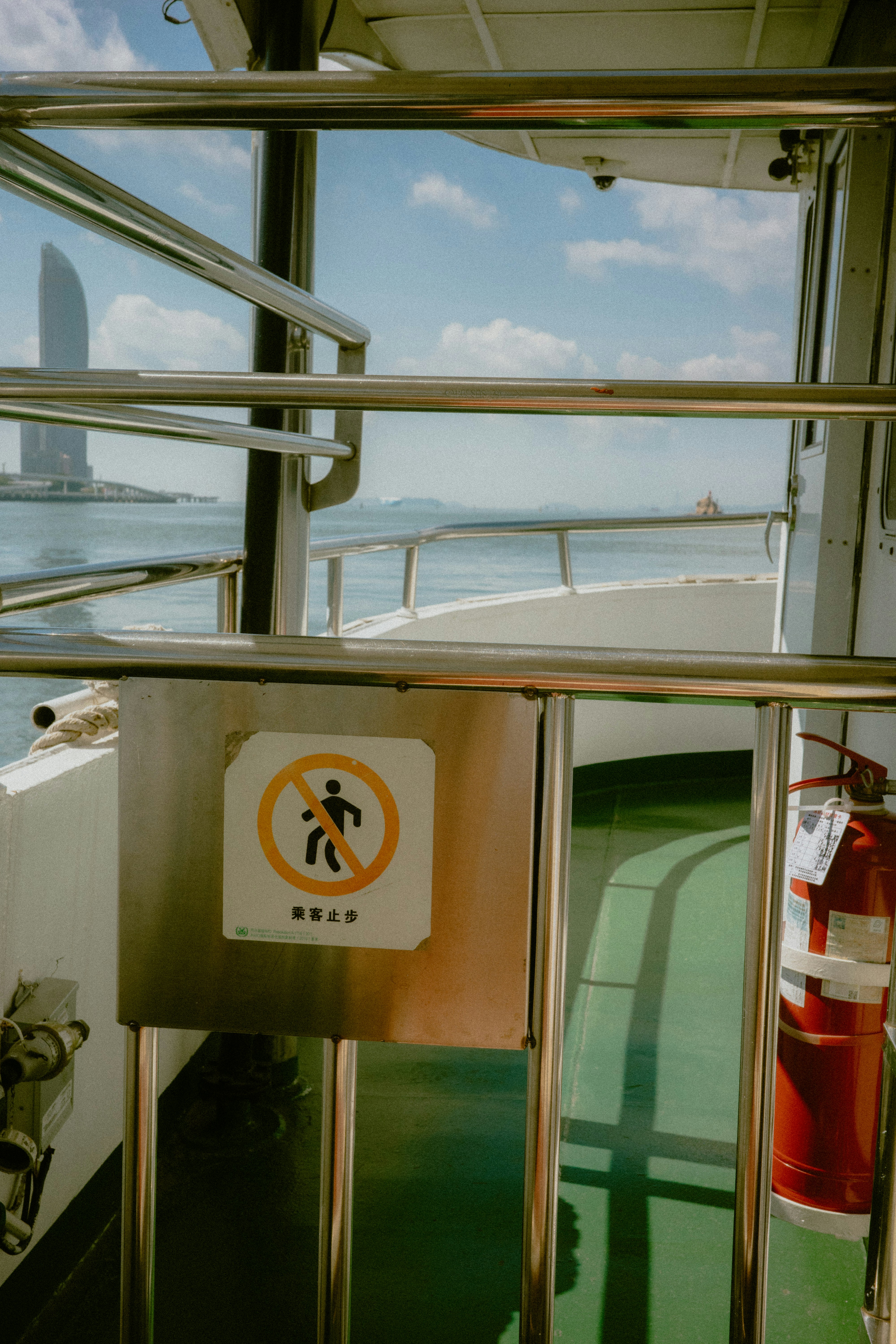 Bright Marina Walk: A Passenger Vessel’s Rail and Skyline