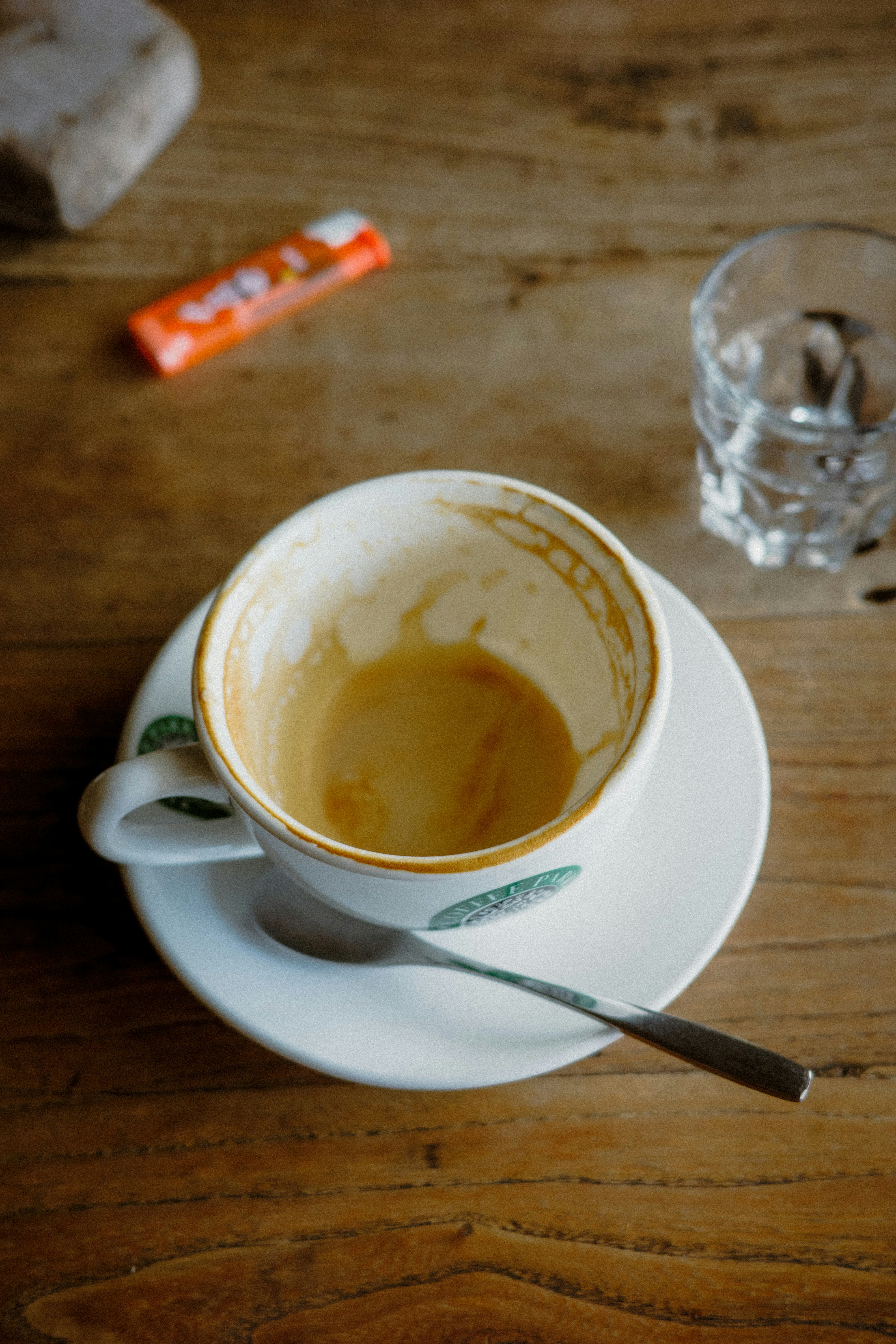 Empty Cup, Quiet Table: A Morning Moment in Wood and Glass