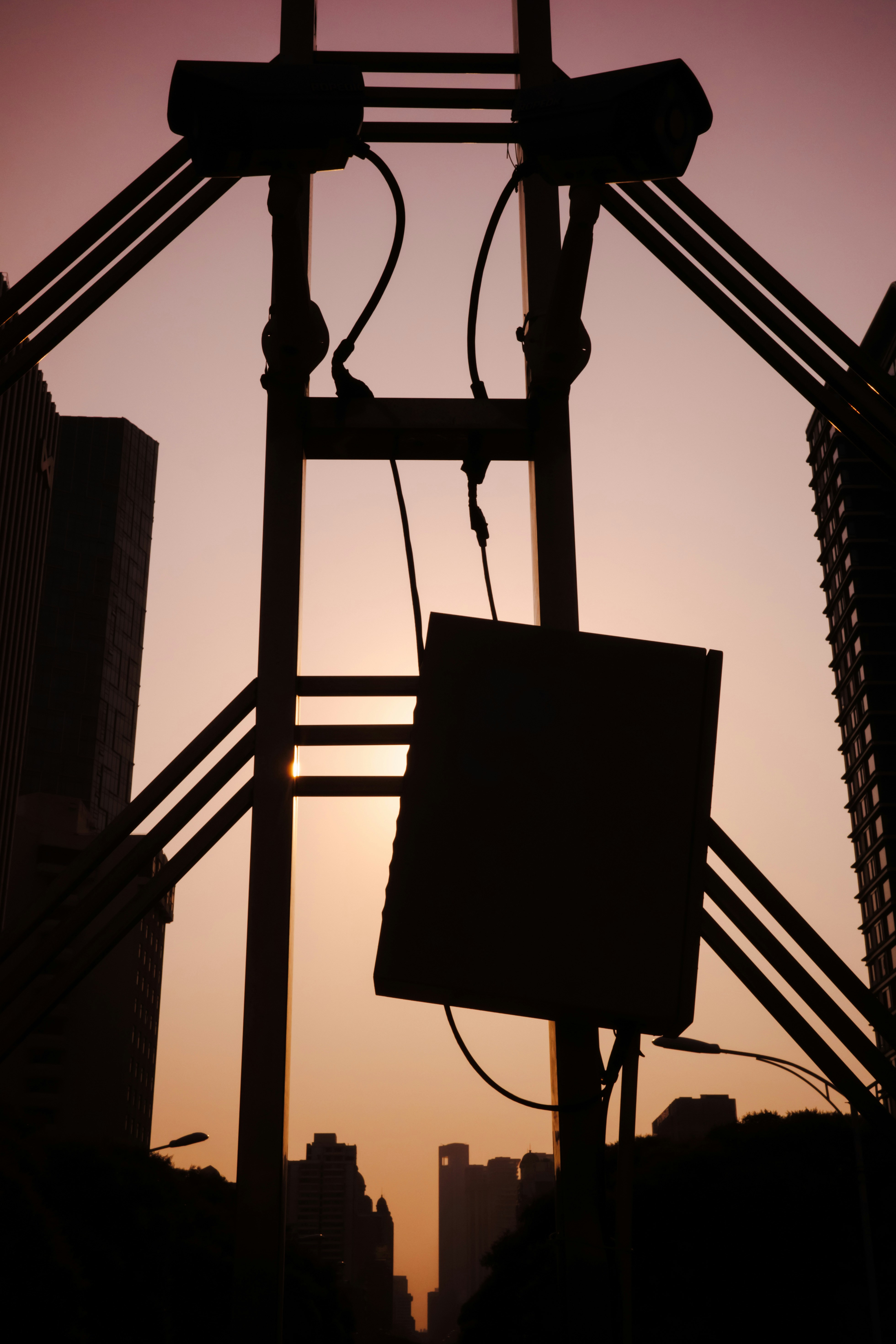 Silhouette at Dusk: A Quiet Crane Frame Against a Golden Horizon