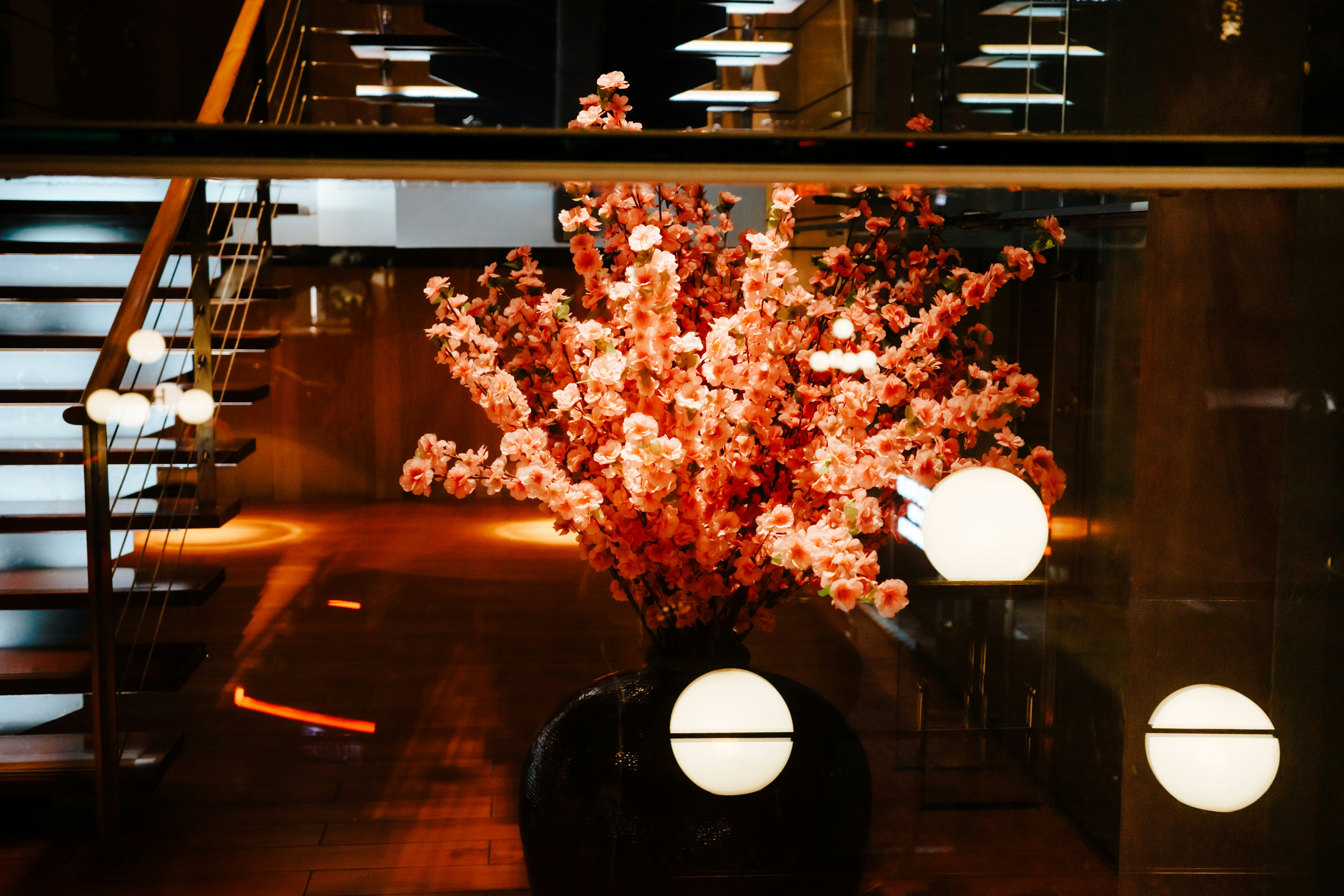 Cherry Blossom Vases: Nightscape Glow in a Modern Atrium