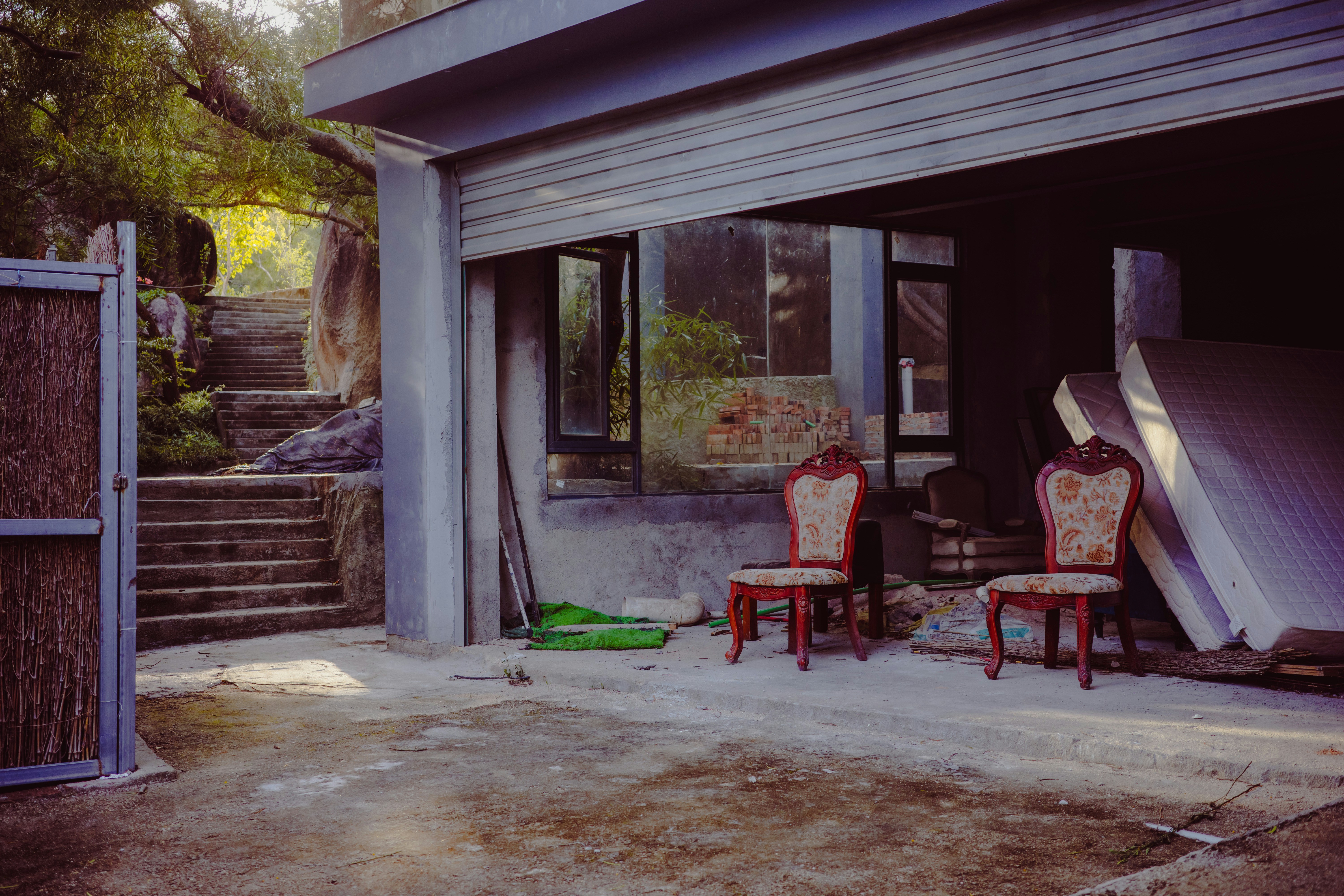 Abandoned Studio: Two Velvet Chairs Guard a Quiet Workshop