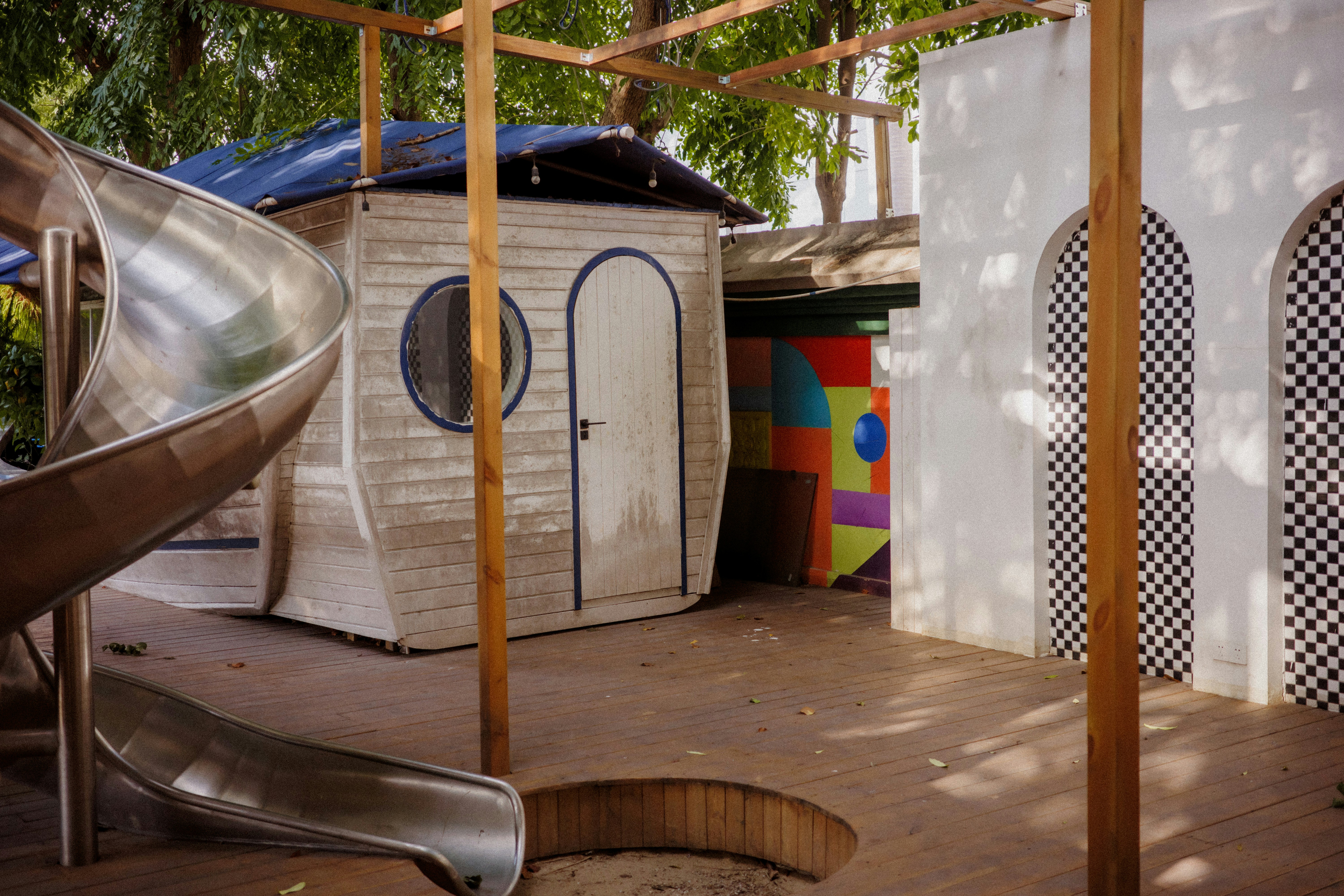 Playground Shadows: A Quiet Corner of Colorful Play Structures