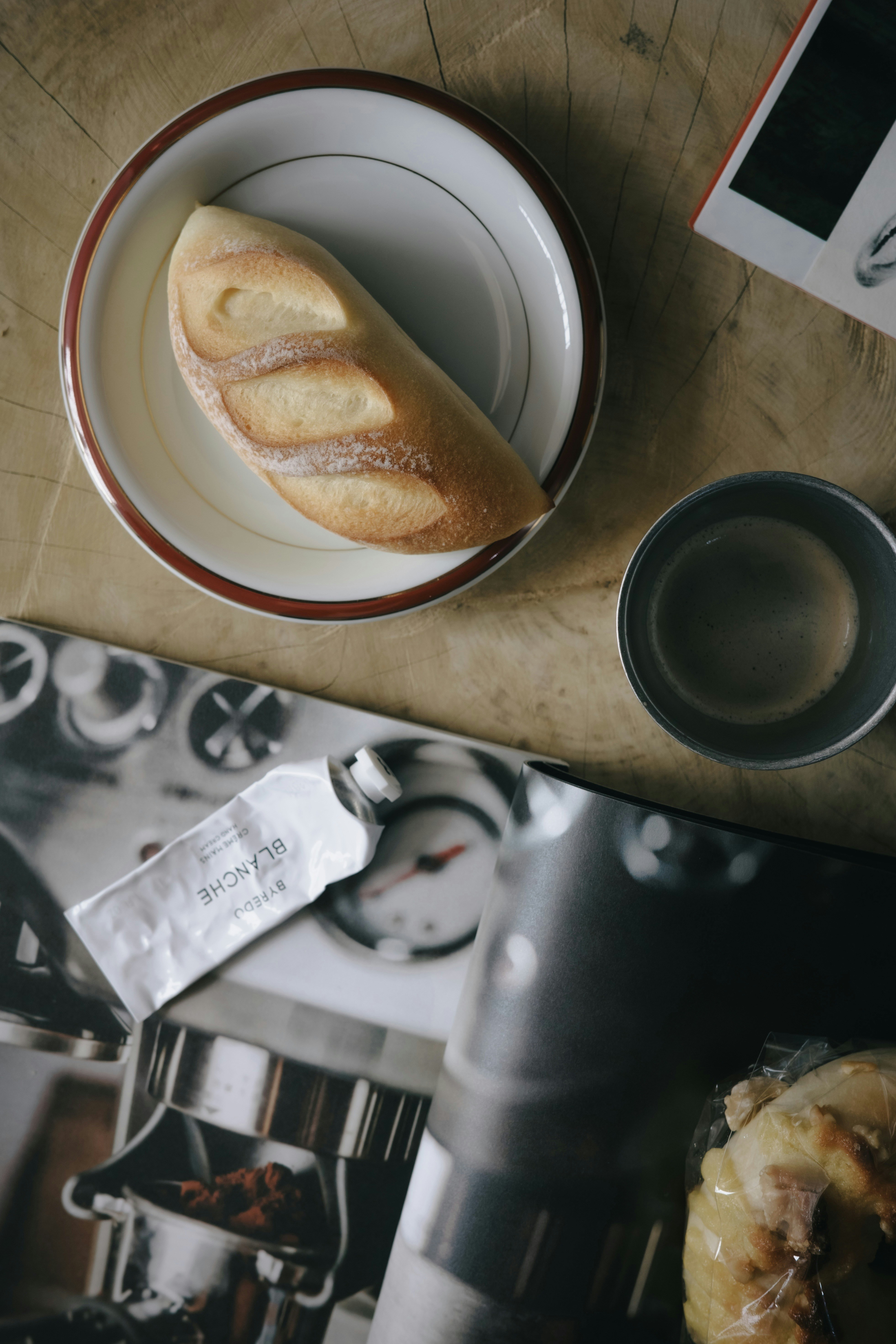 A Quiet Café Moment: Bread, Coffee, and a Polaroid Pause