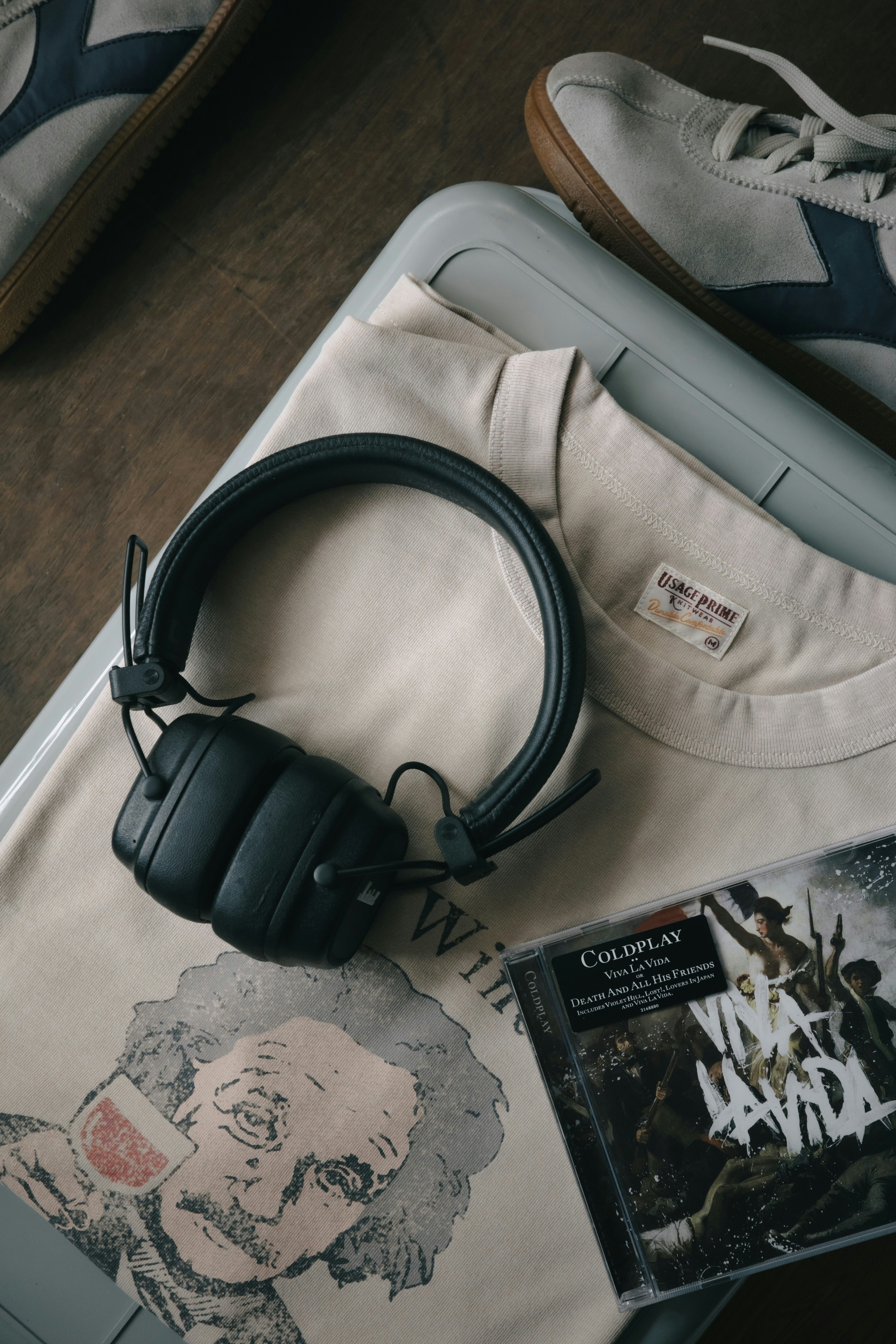 Headphones and album on a vintage scene: a laid-back still-life.