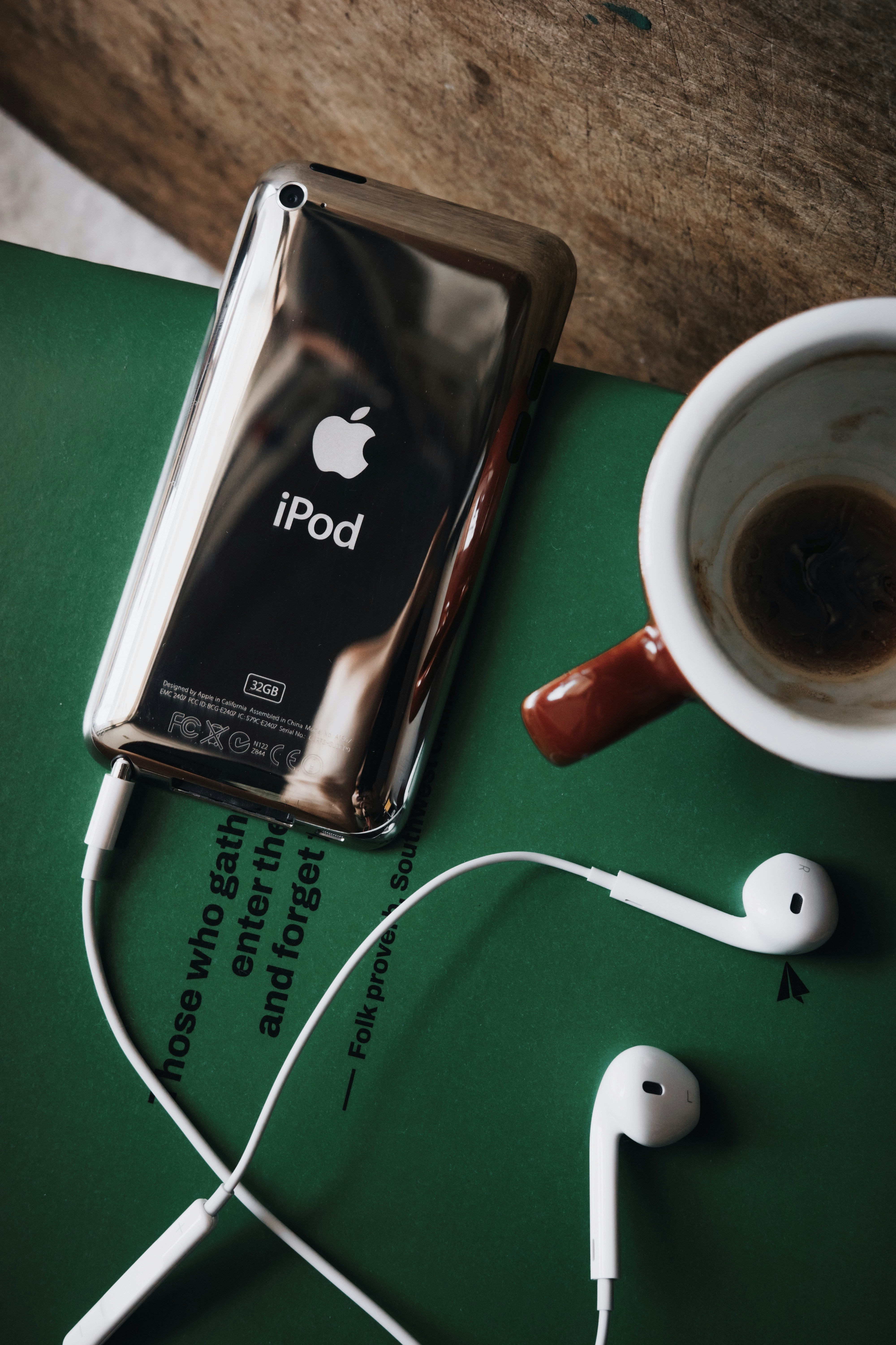 Shiny iPod Shielded by Coffee Ring: A Moment with Tech and Tea