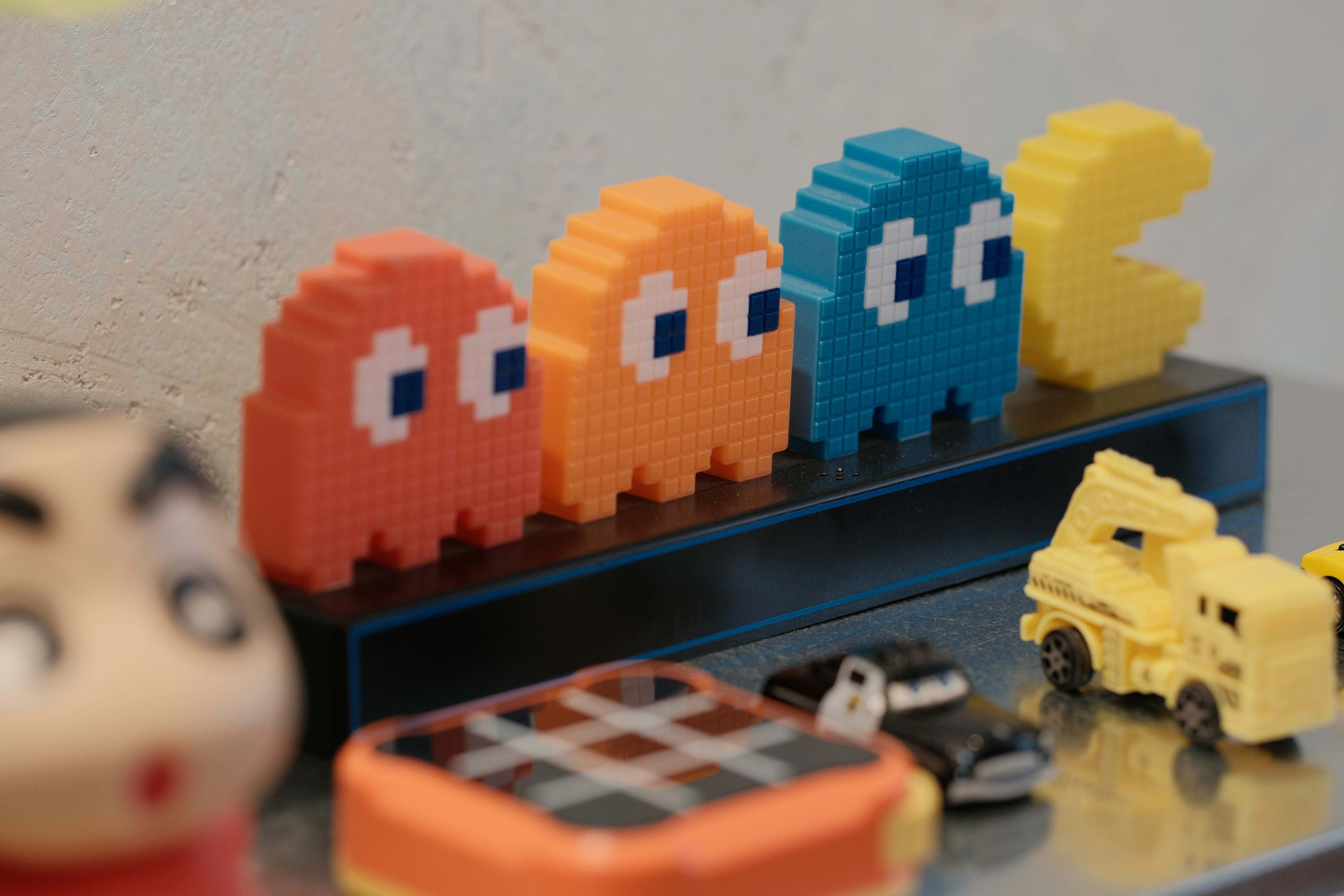 Pixel Parade on a Toy Shelf