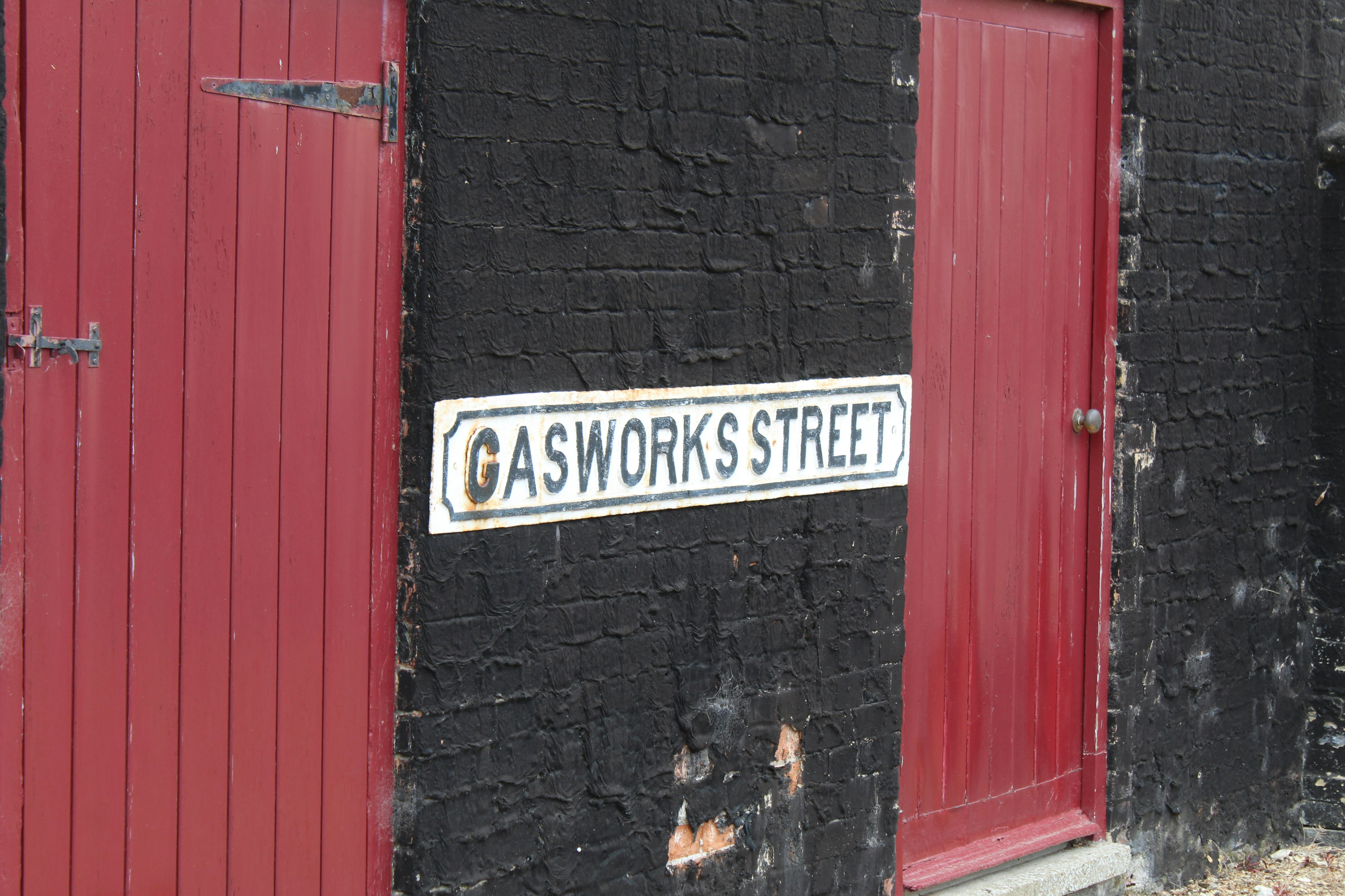 Gasworks Street Sign Against Weathered Brick