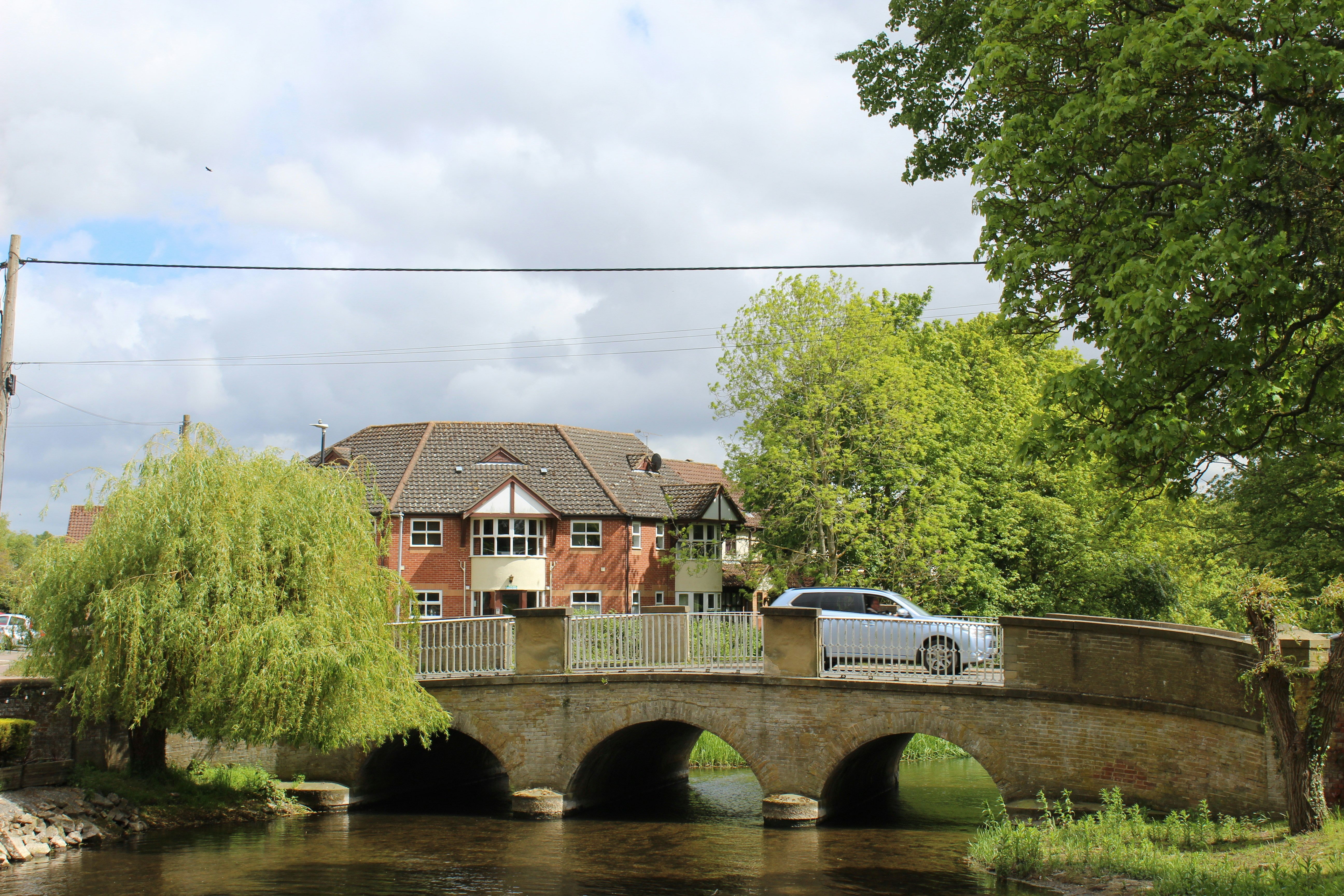 Brick Bridge Over River: A Quiet Town Moment