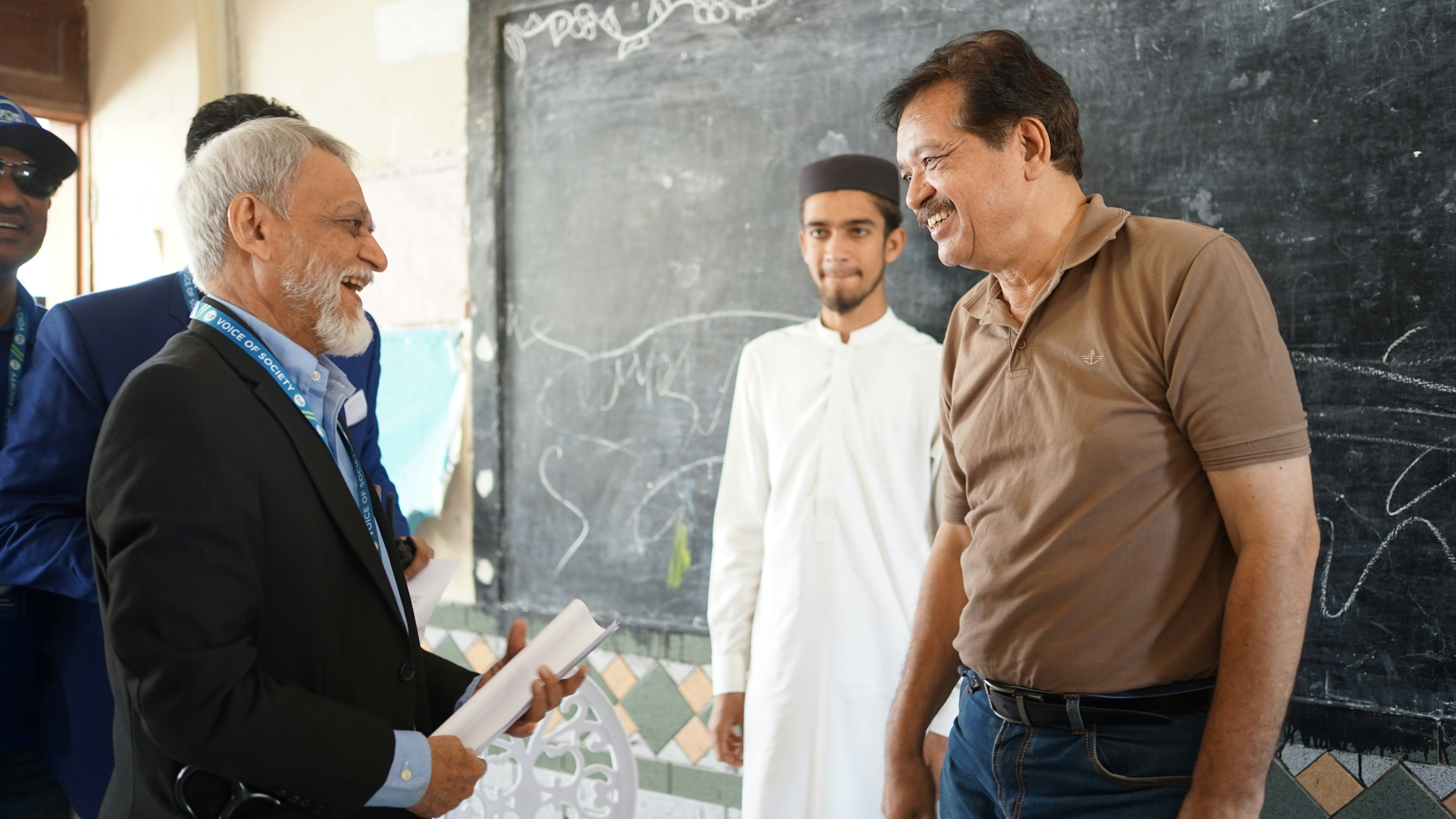 Smiles Across the Chalkboard: Community Leaders Meet in Classroom