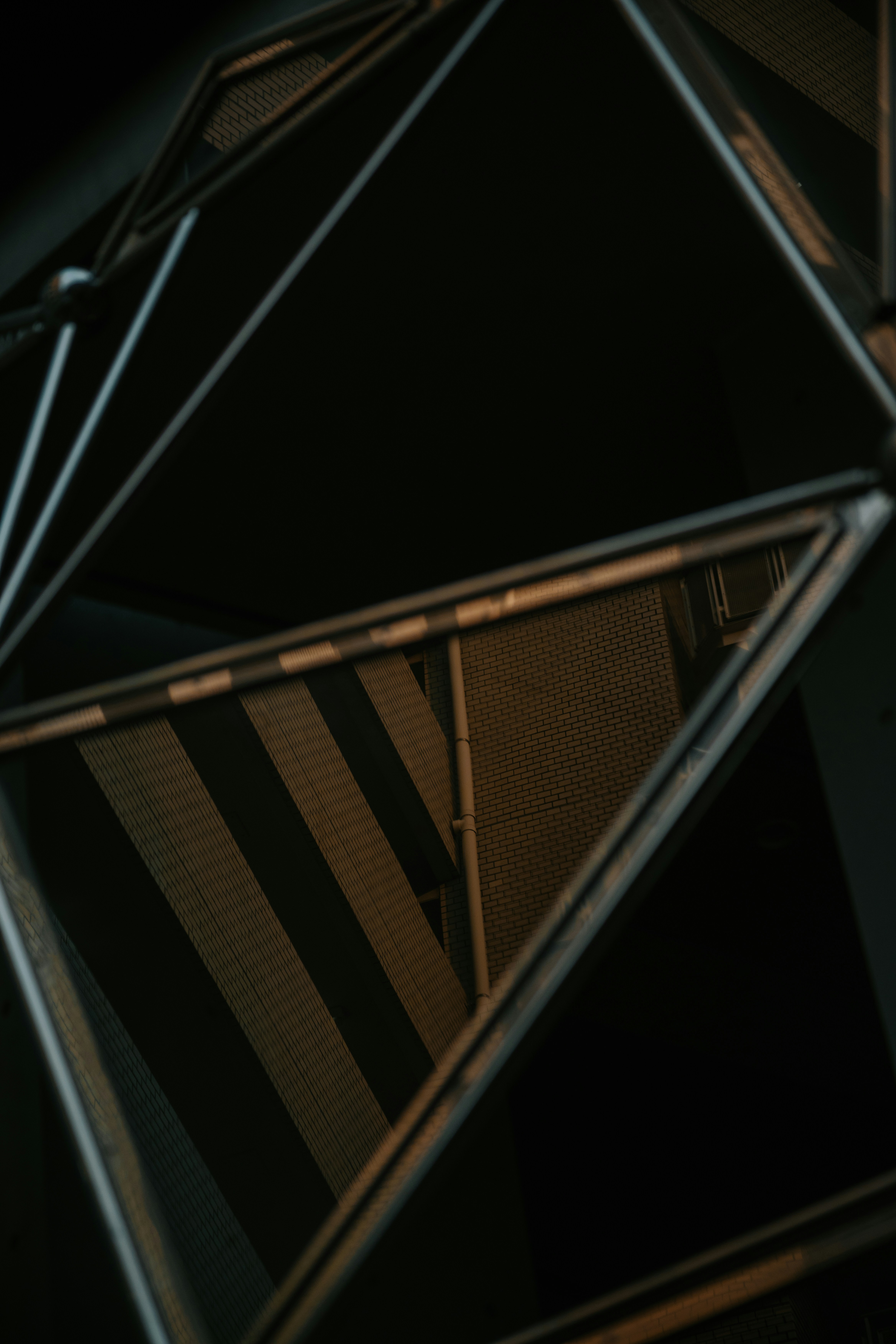 Geometric Echoes: Fractured Metal and Glass in Low Light