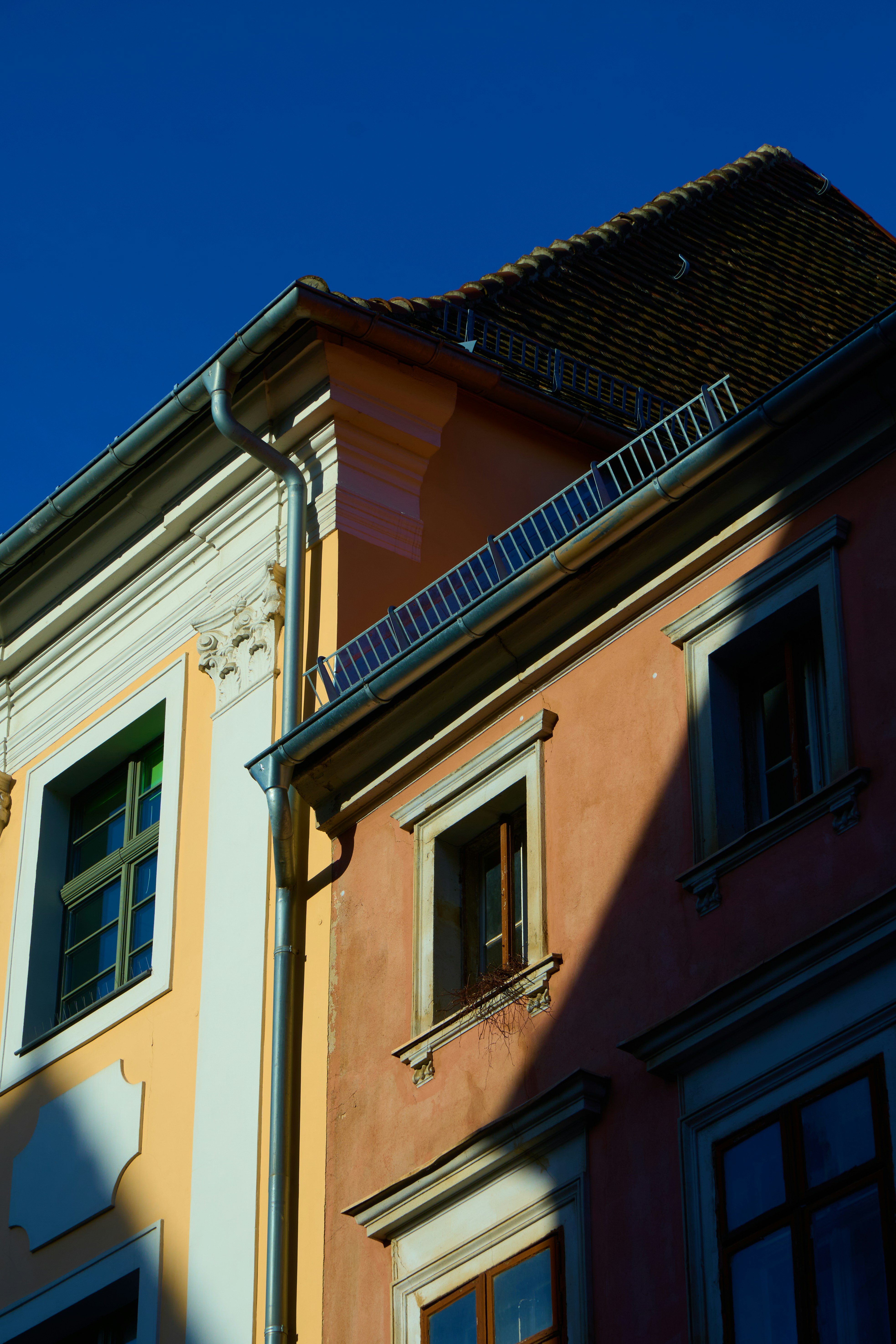 Sunlit Corners: A Tilted Tale of Colorful Facades