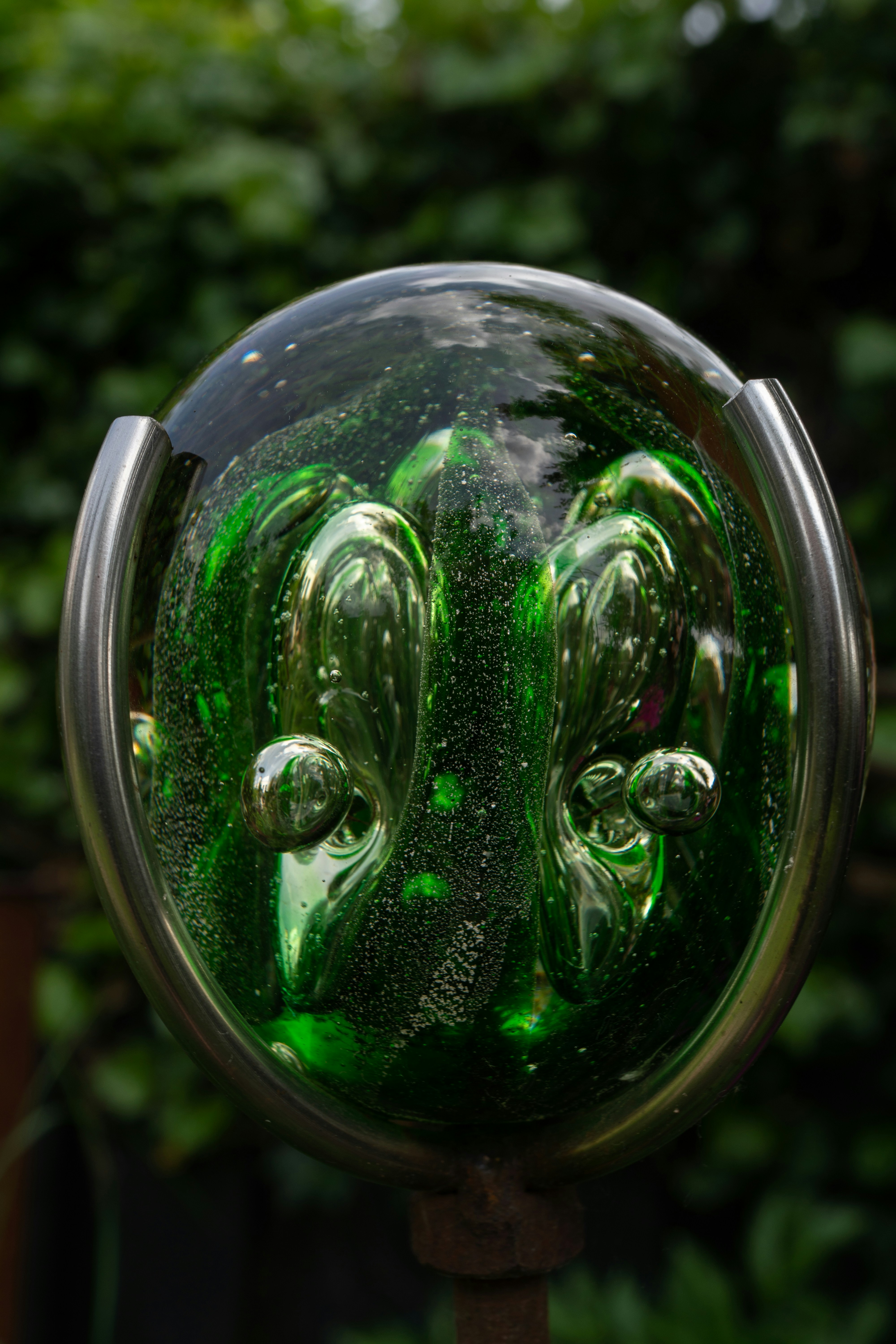 Emerald Glass Sentinel: A Close-Up on a Green Globe