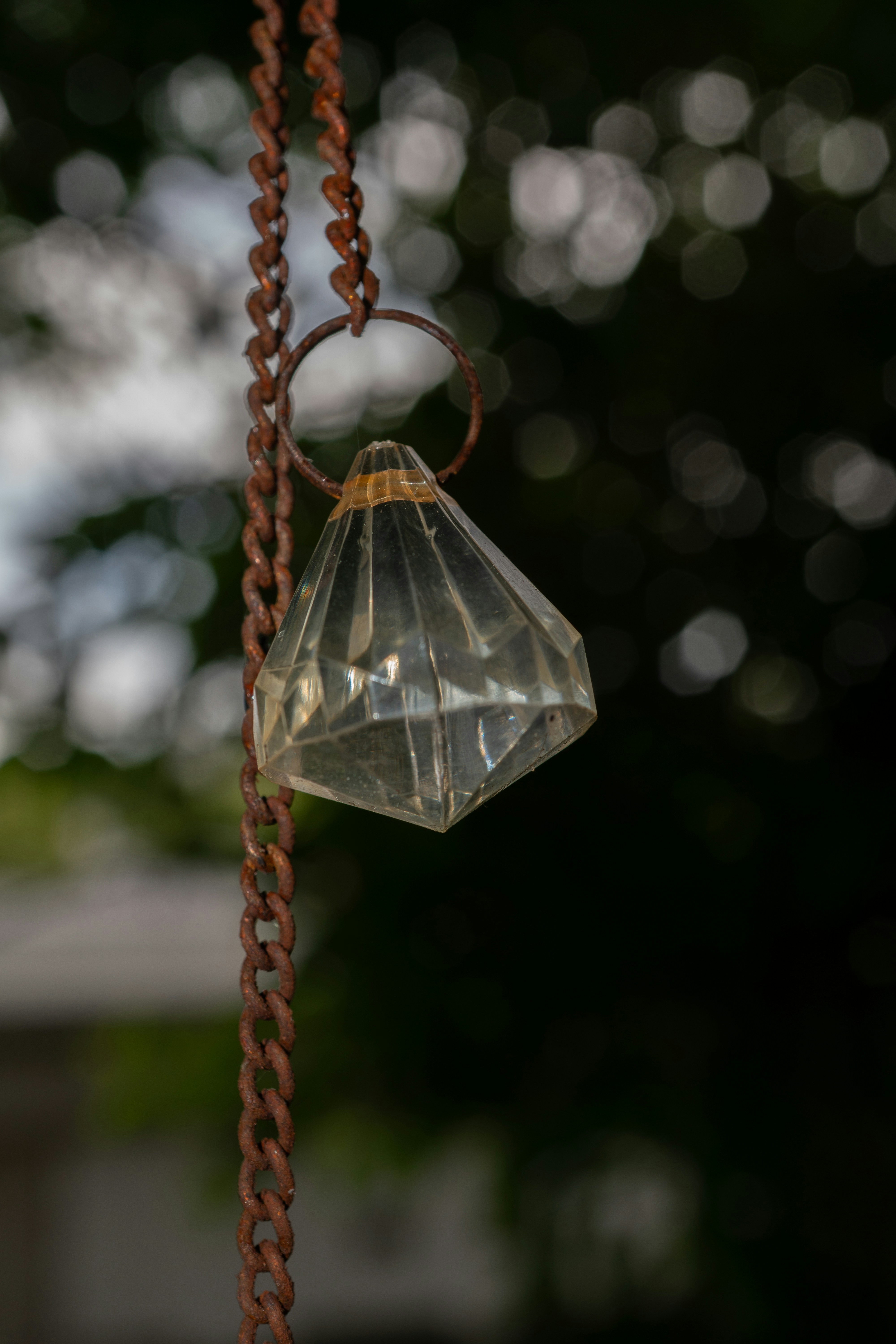 Rusty Chain Pendant: A Prismatic Accent in Soft Fall Light