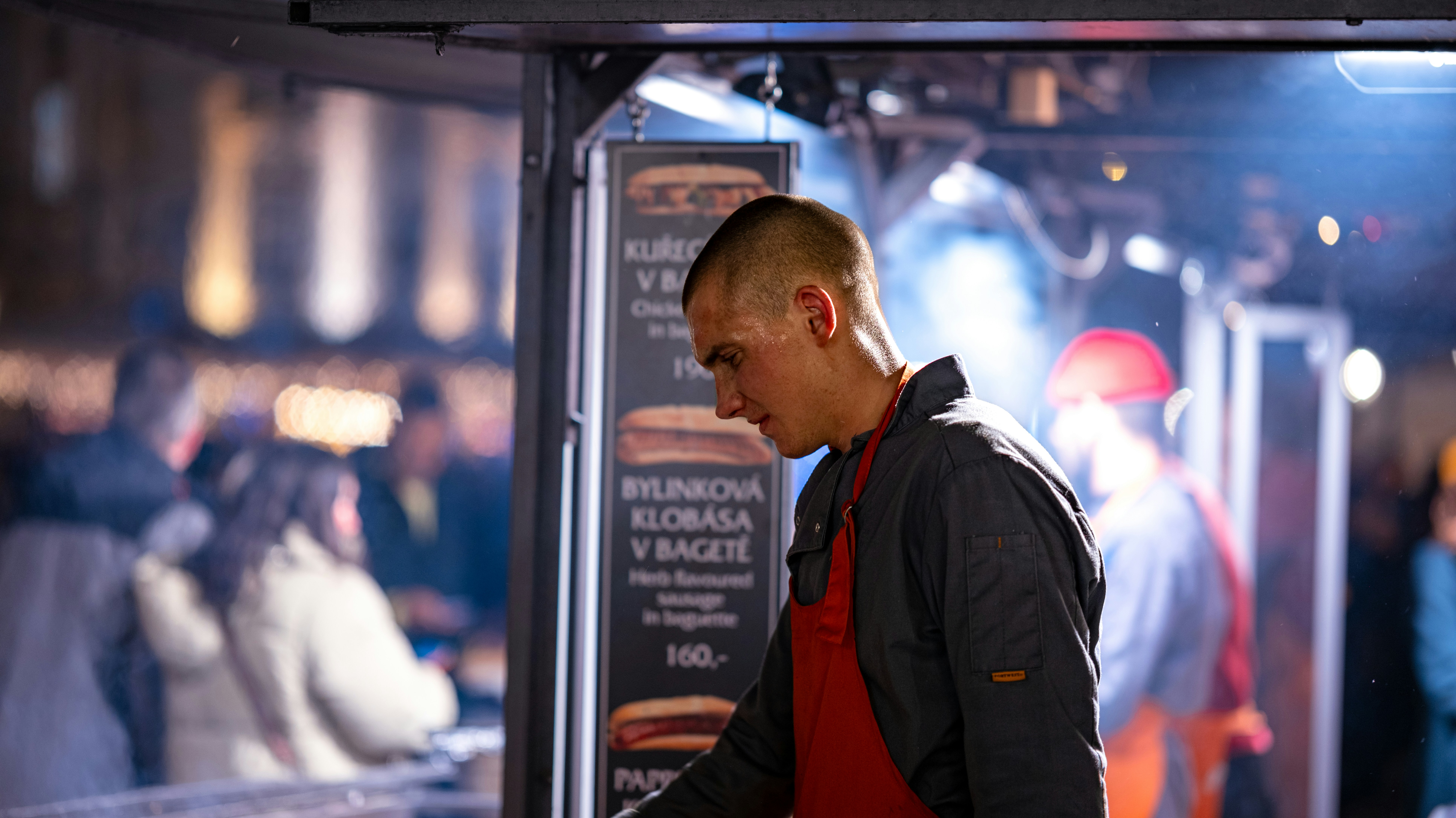 Street Vendor in a Neon-Lawned Night Market