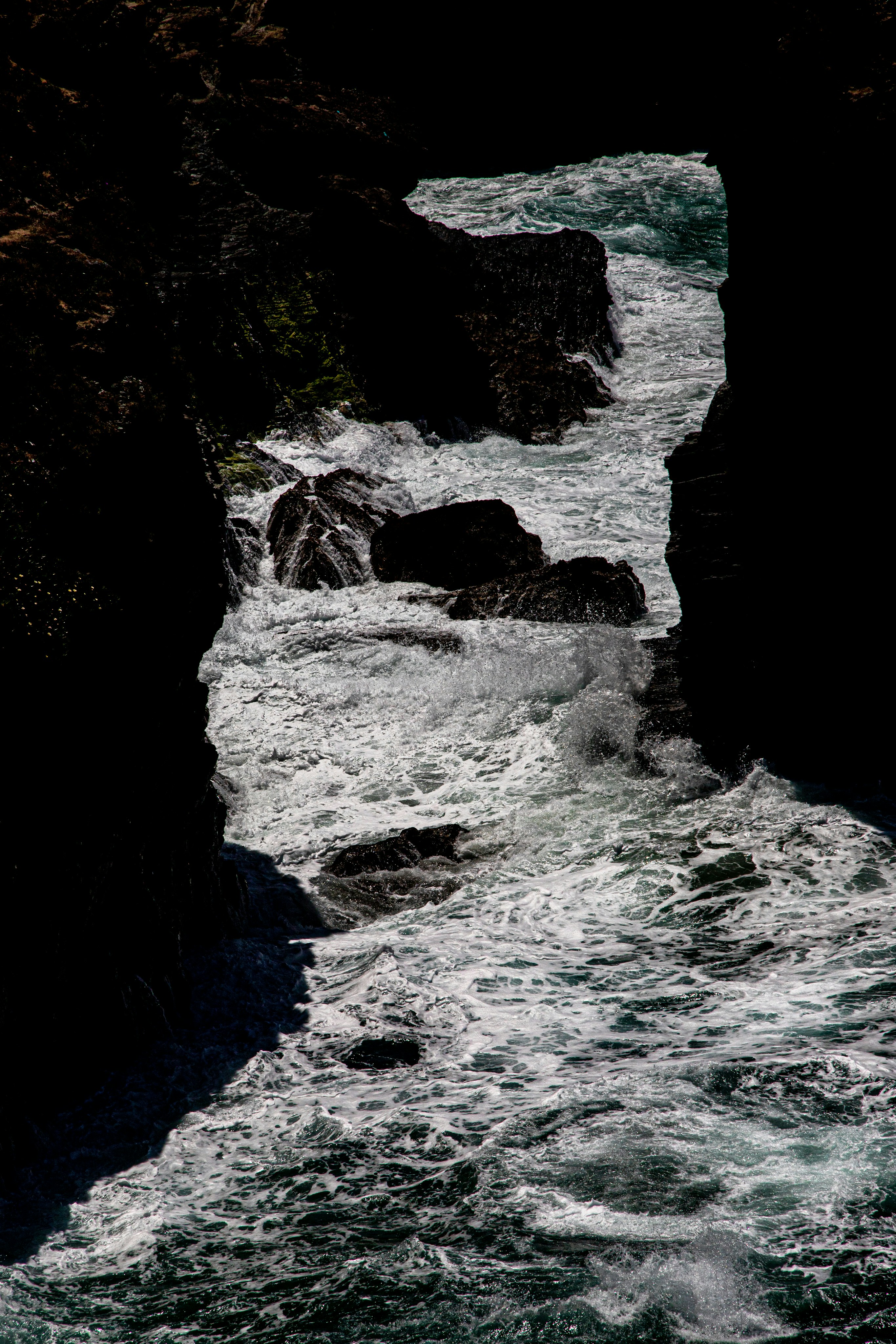 Chasm of surf: a narrow inlet carved by relentless tides