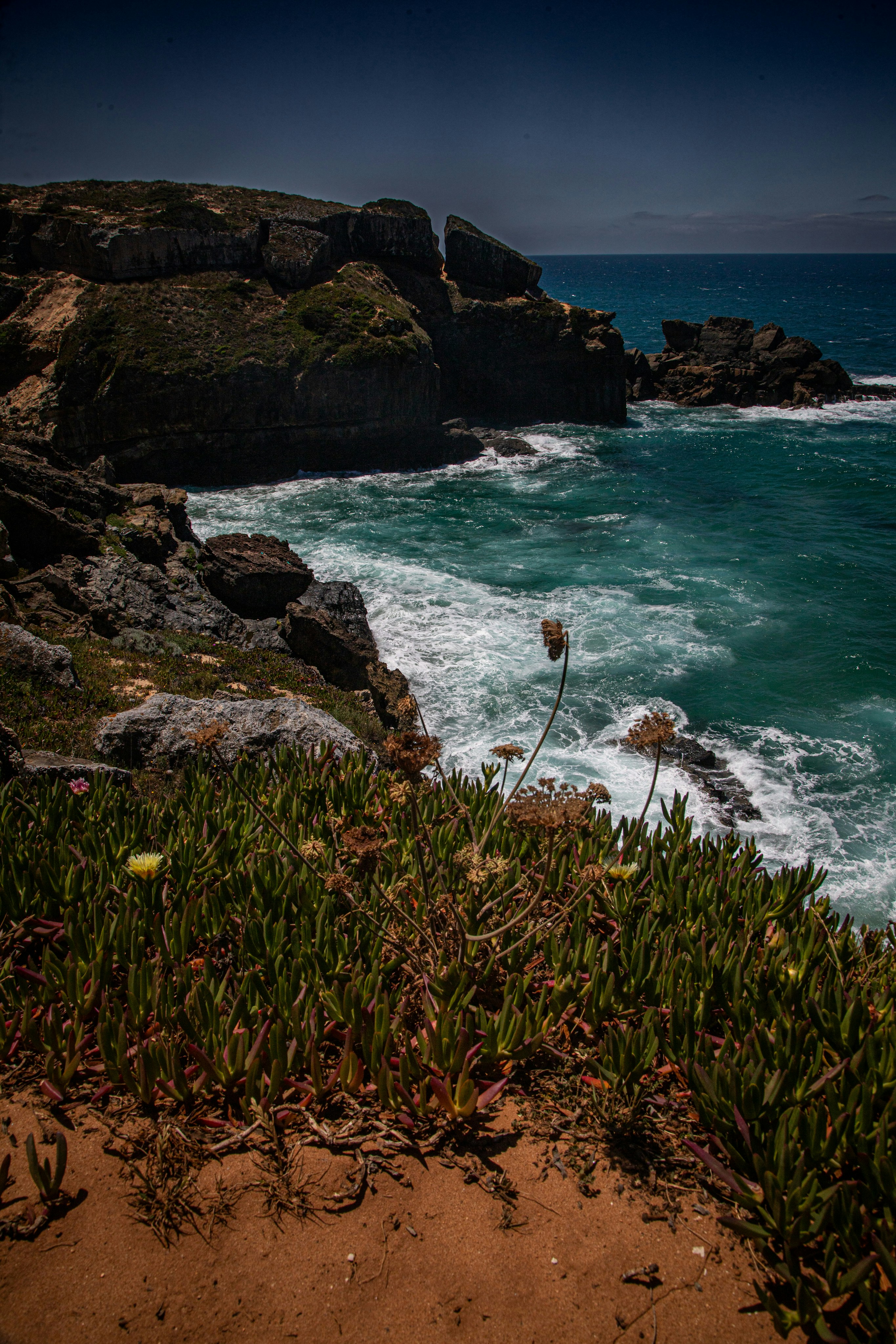 Cliffside Dunes Over Turquoise Seas