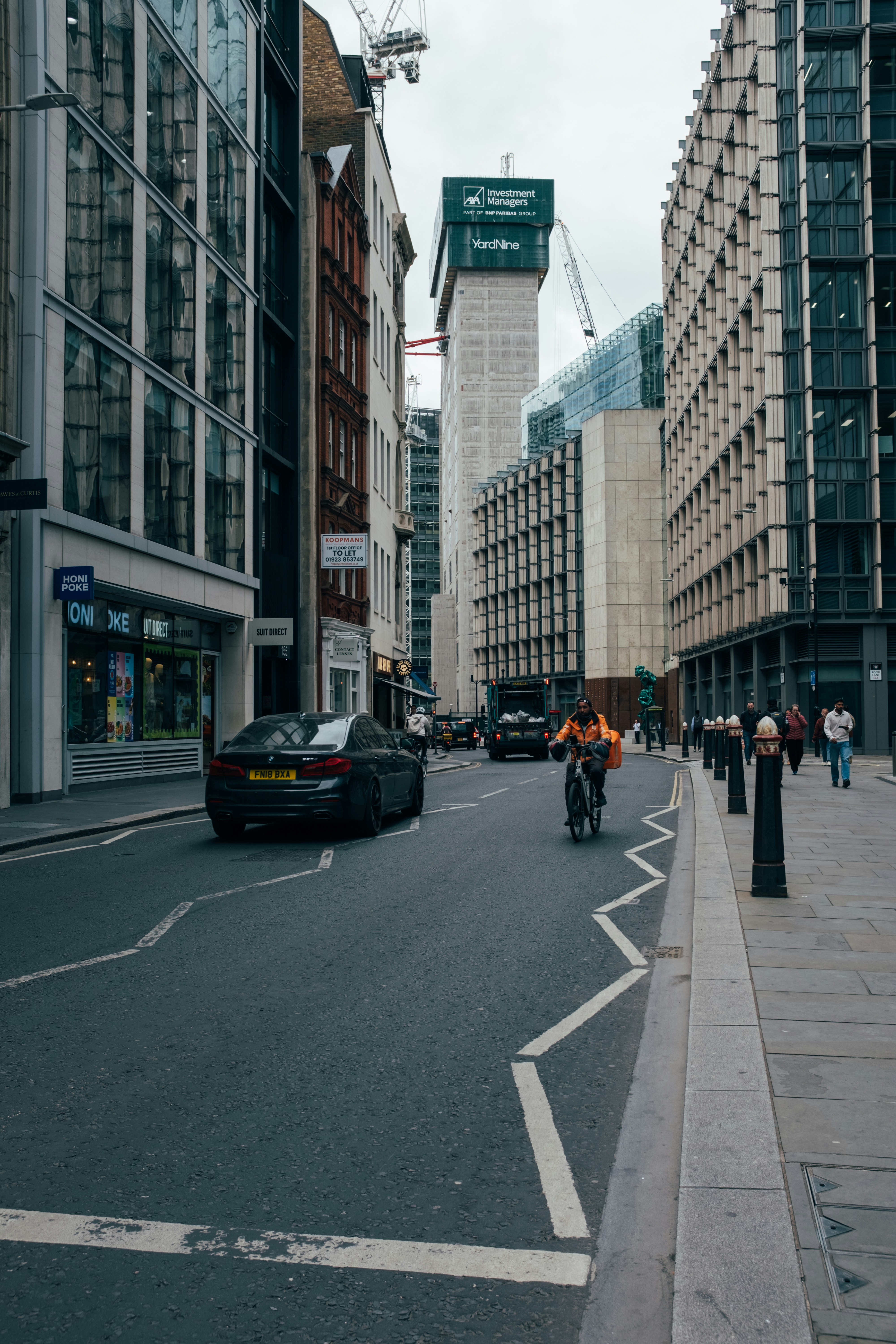 Urban Corridor: Cyclist in the Heart of City Rhythm
