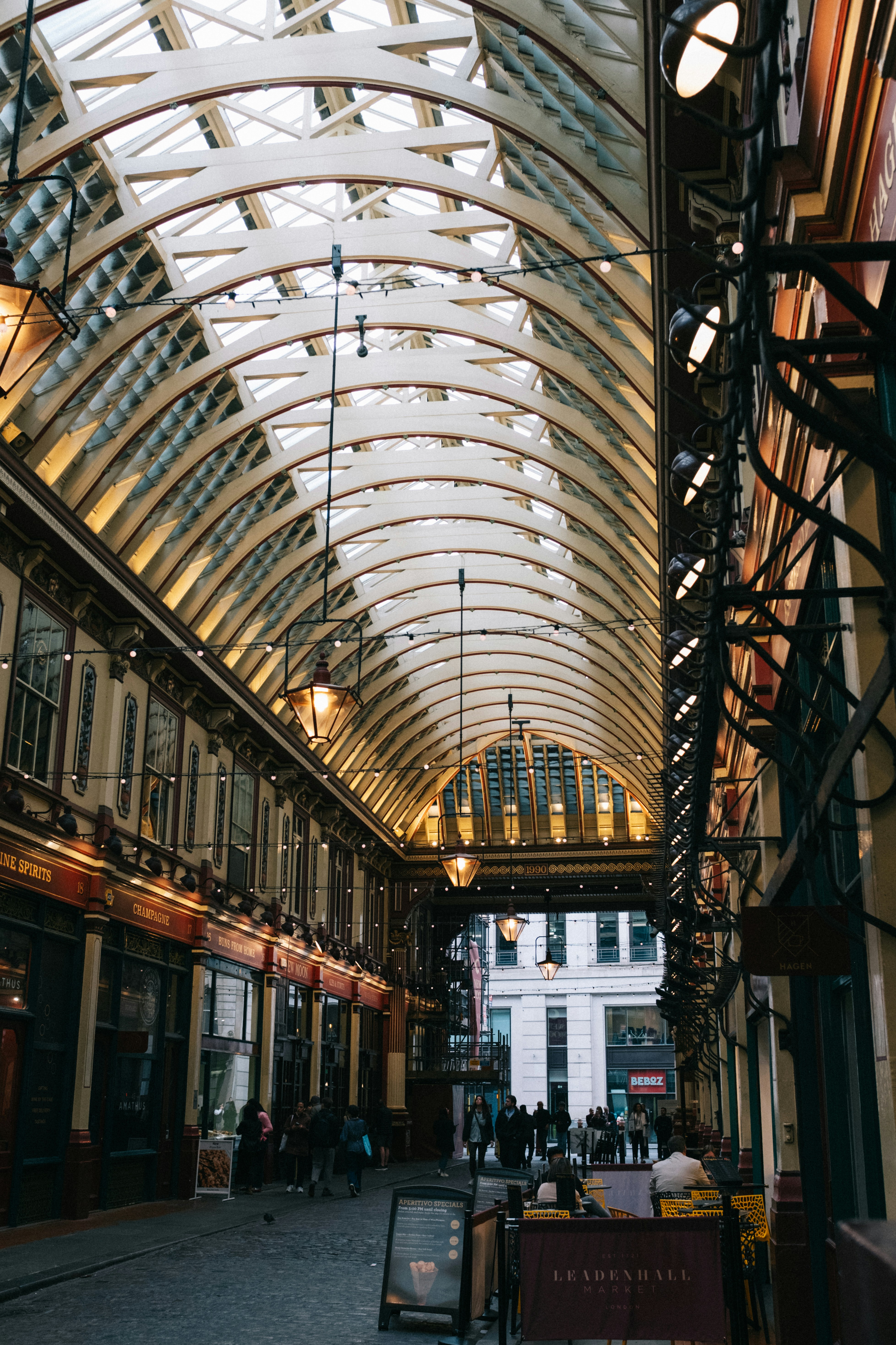 Cobalt Arches: A Sunlit Alley of Glass and Iron