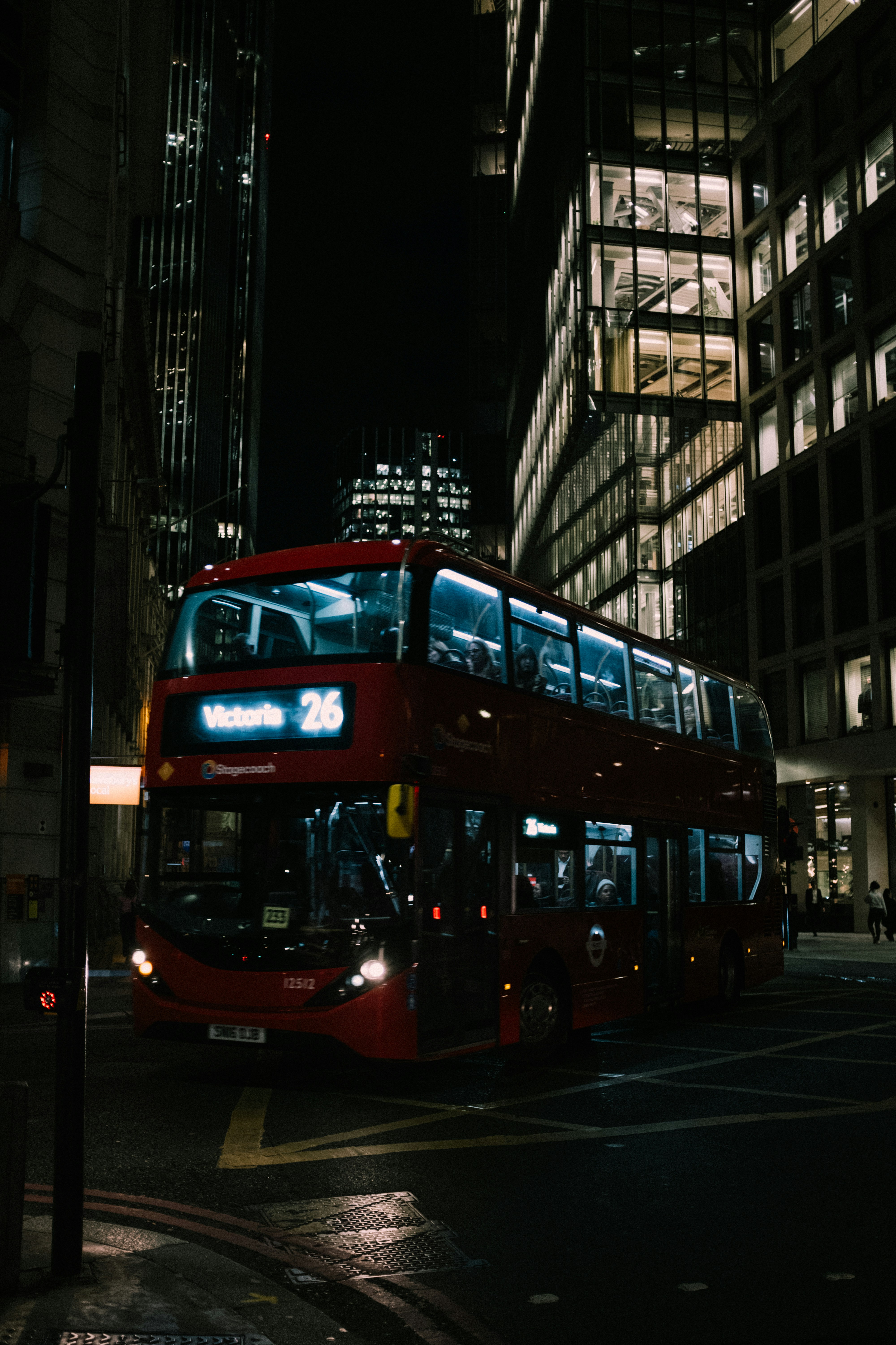 Midnight Red: A London Double-Decker Under Streetlights