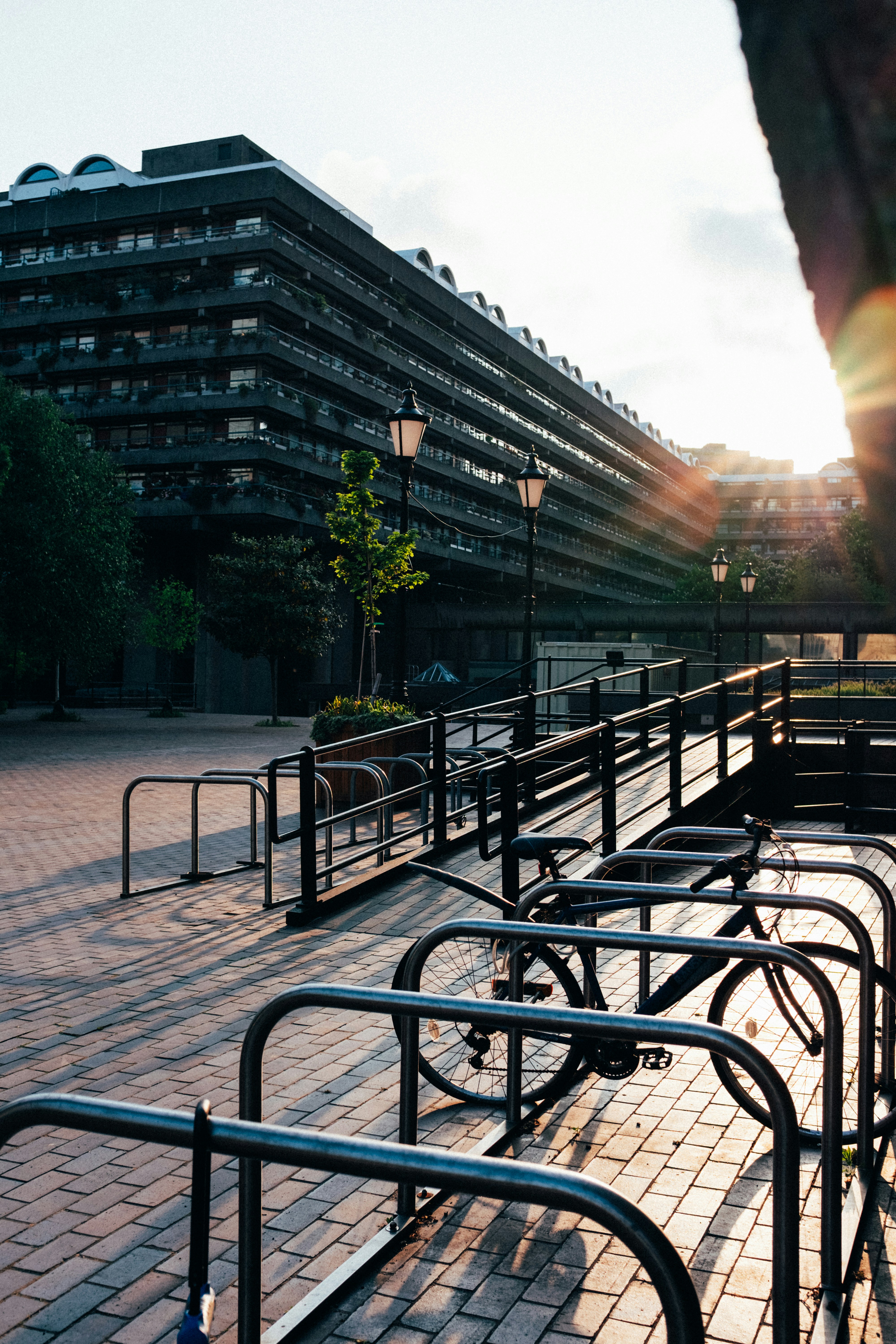 Sunlit Ramps and Silent Bikes: An Urban Courtyard at Dusk