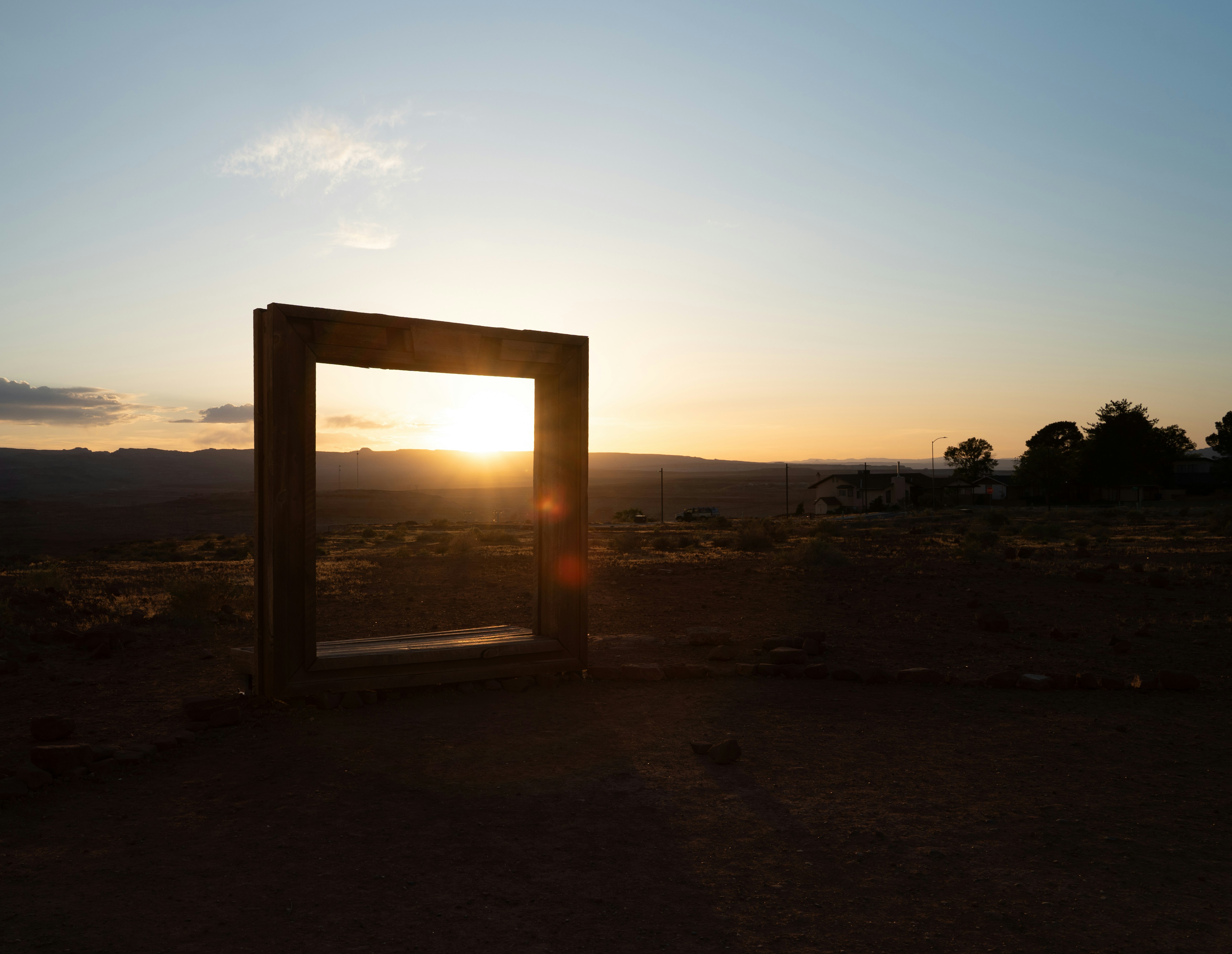 Through the Frame: Sunset Horizon Aligned with a Puzzle-like Doorway