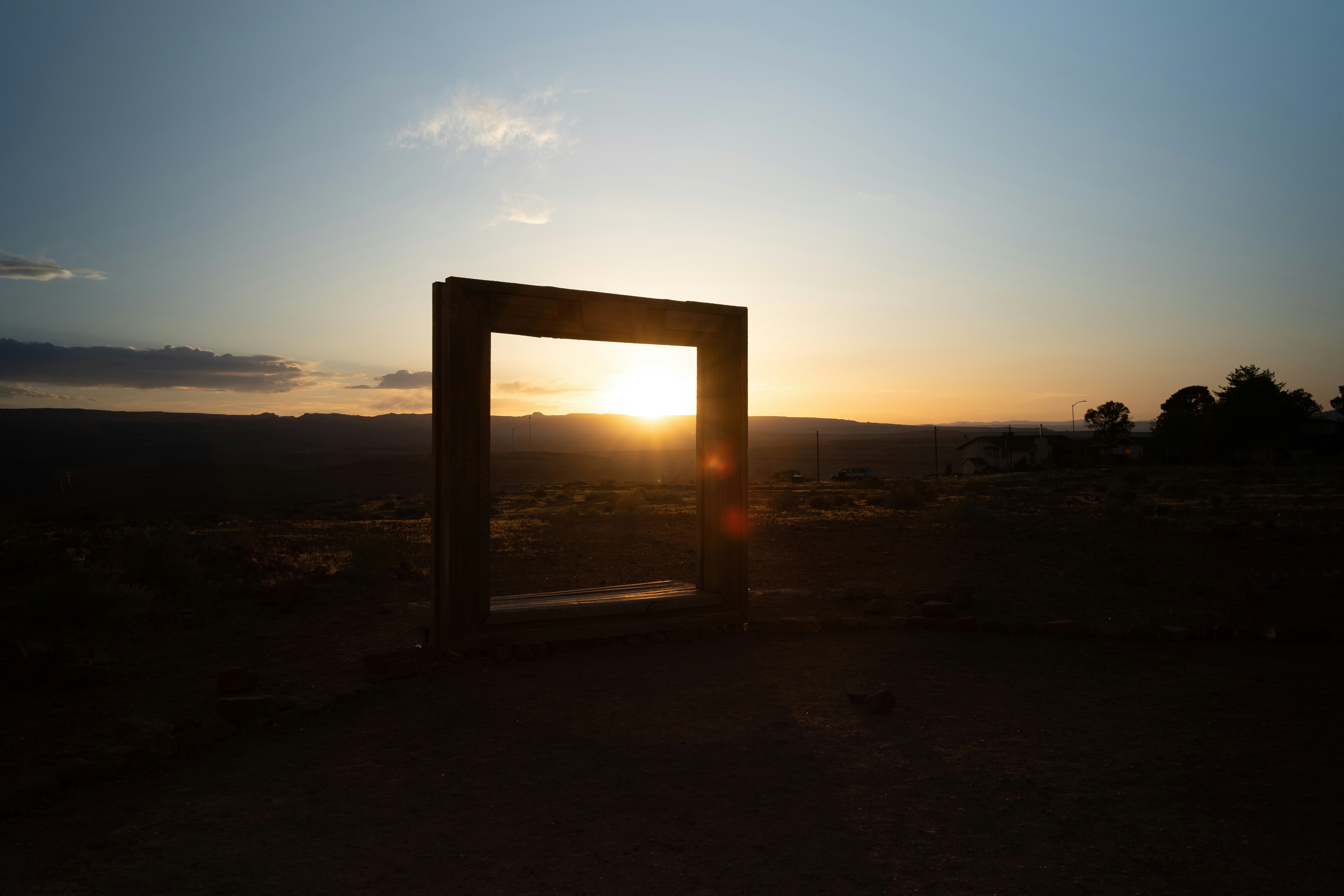 Framed Horizon: Sunlit Aperture in a Desert Plain