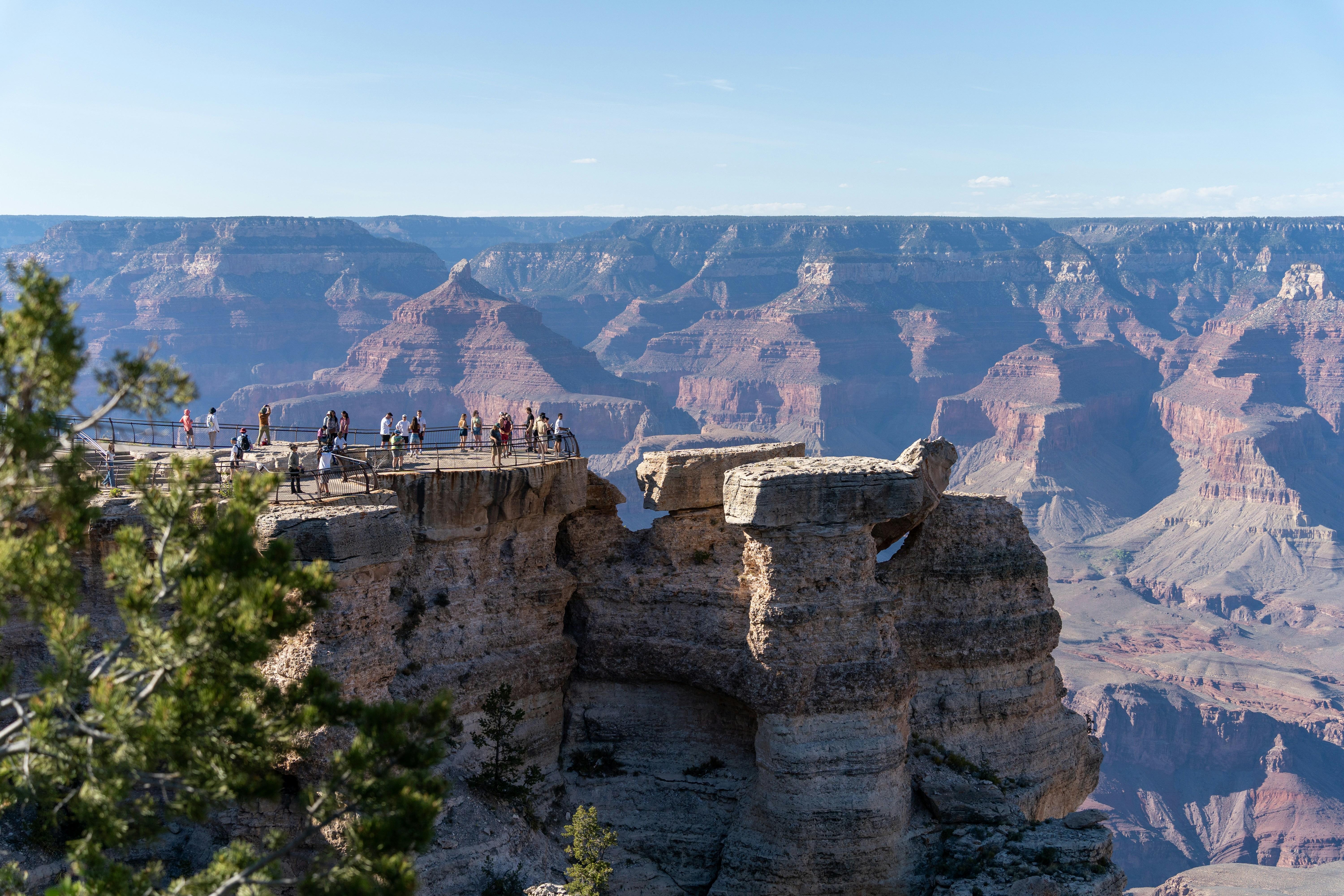 Cliff Edge Whisper: Tourists at the Canyon Vista
