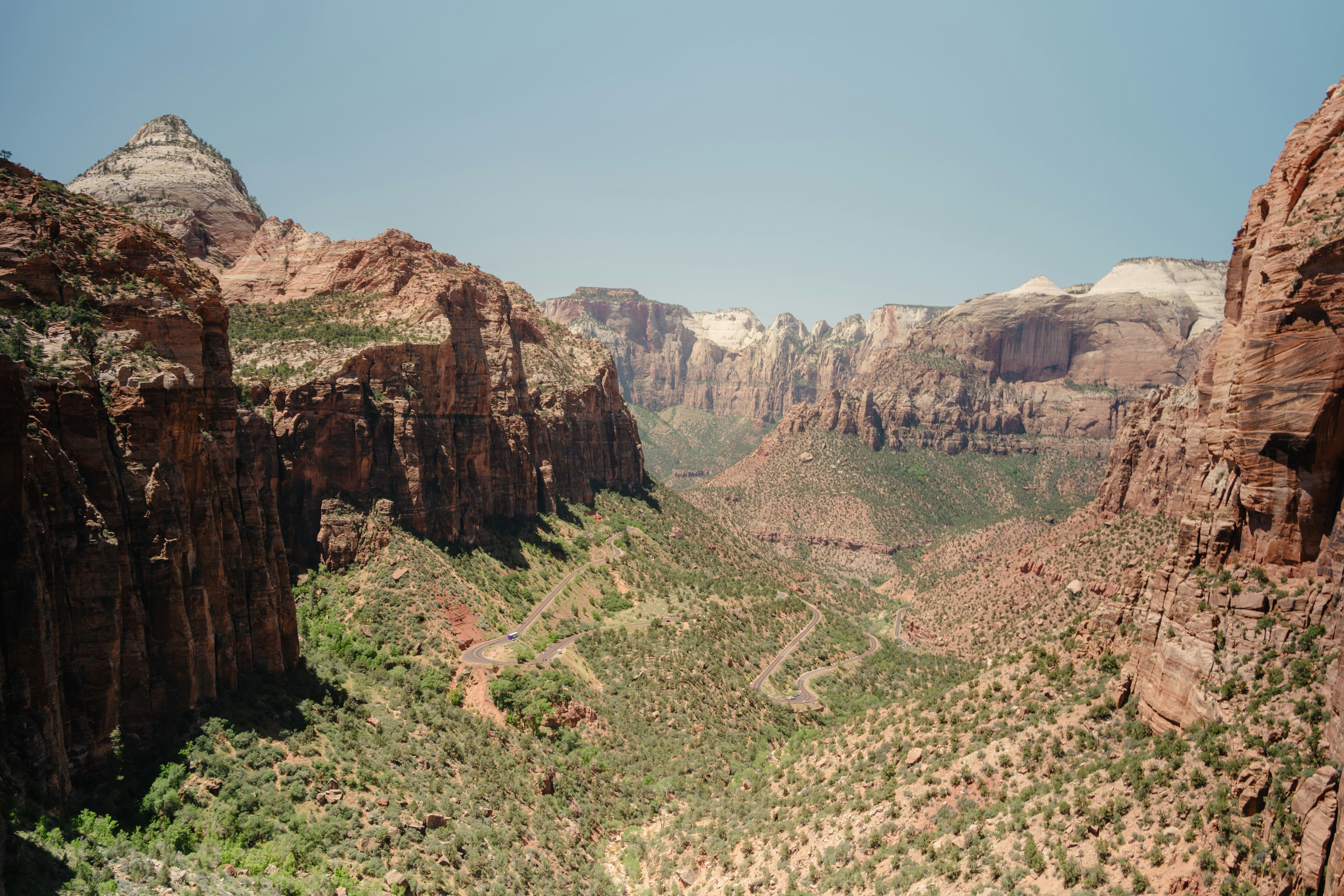 Vast Canyon Ribbon: A Panorama of Red Rock Chasms and Winding Trails