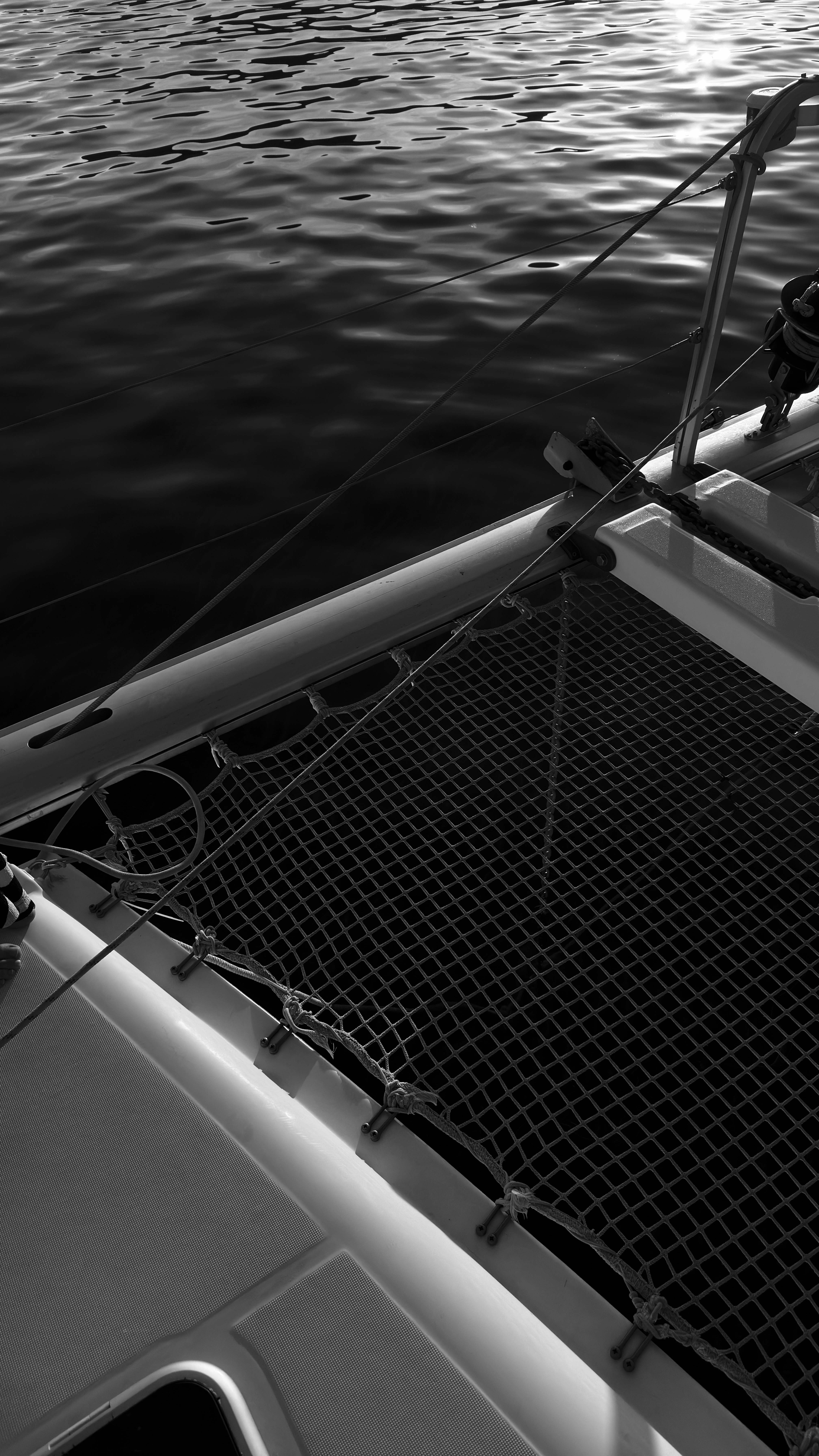 Sailing Mesh: Close-up of the Deck and Rigging on a Quiet Vessel