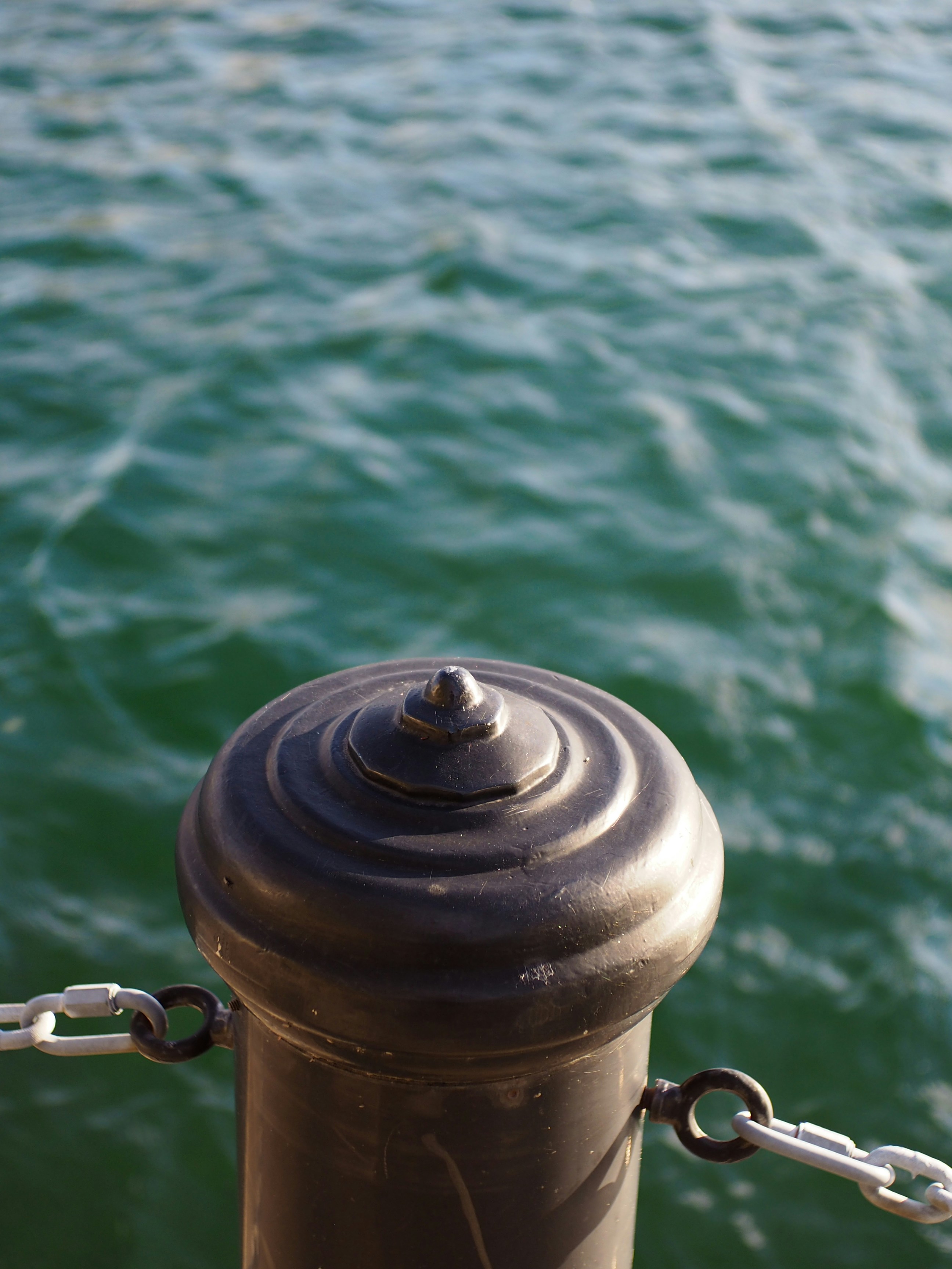Dockside Post: A Close-Up of the Pier Top with Seascape Backdrop