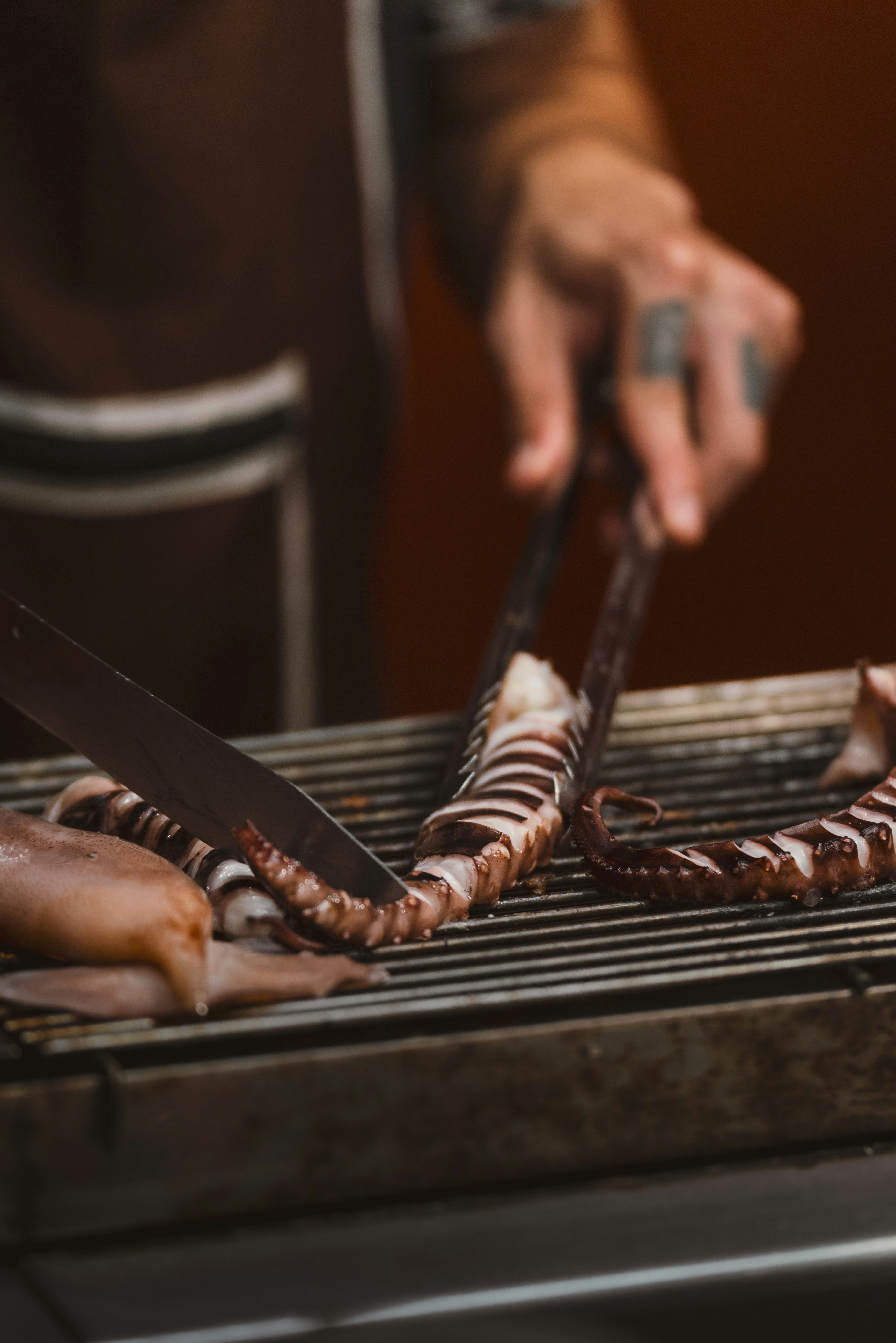 Twisted tentacles on the grill: an intimate moment of squid skewers sizzling