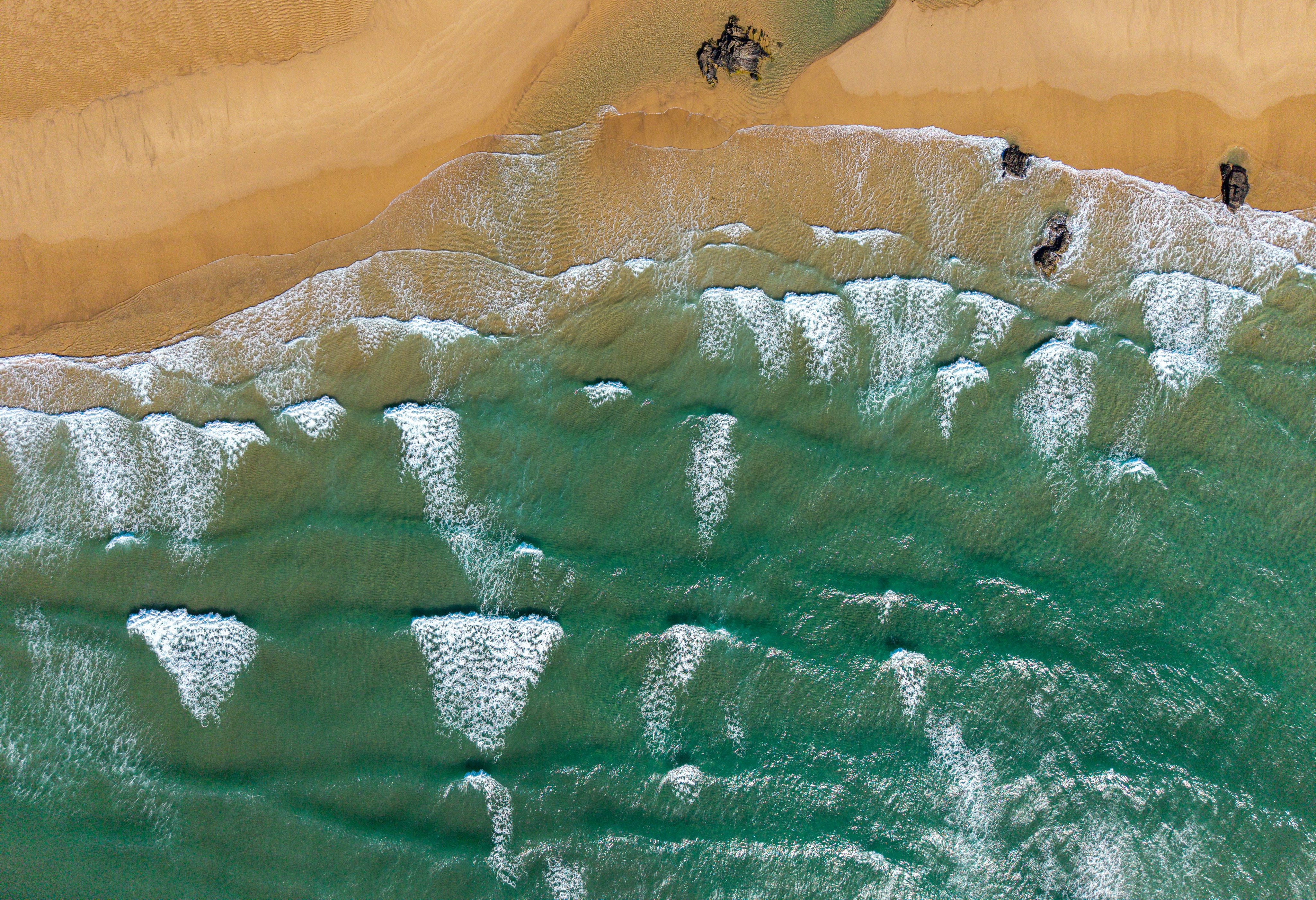 Coastal Dunes Meet Turquoise Breakers: A Drone's Eye on Shoreline Lines