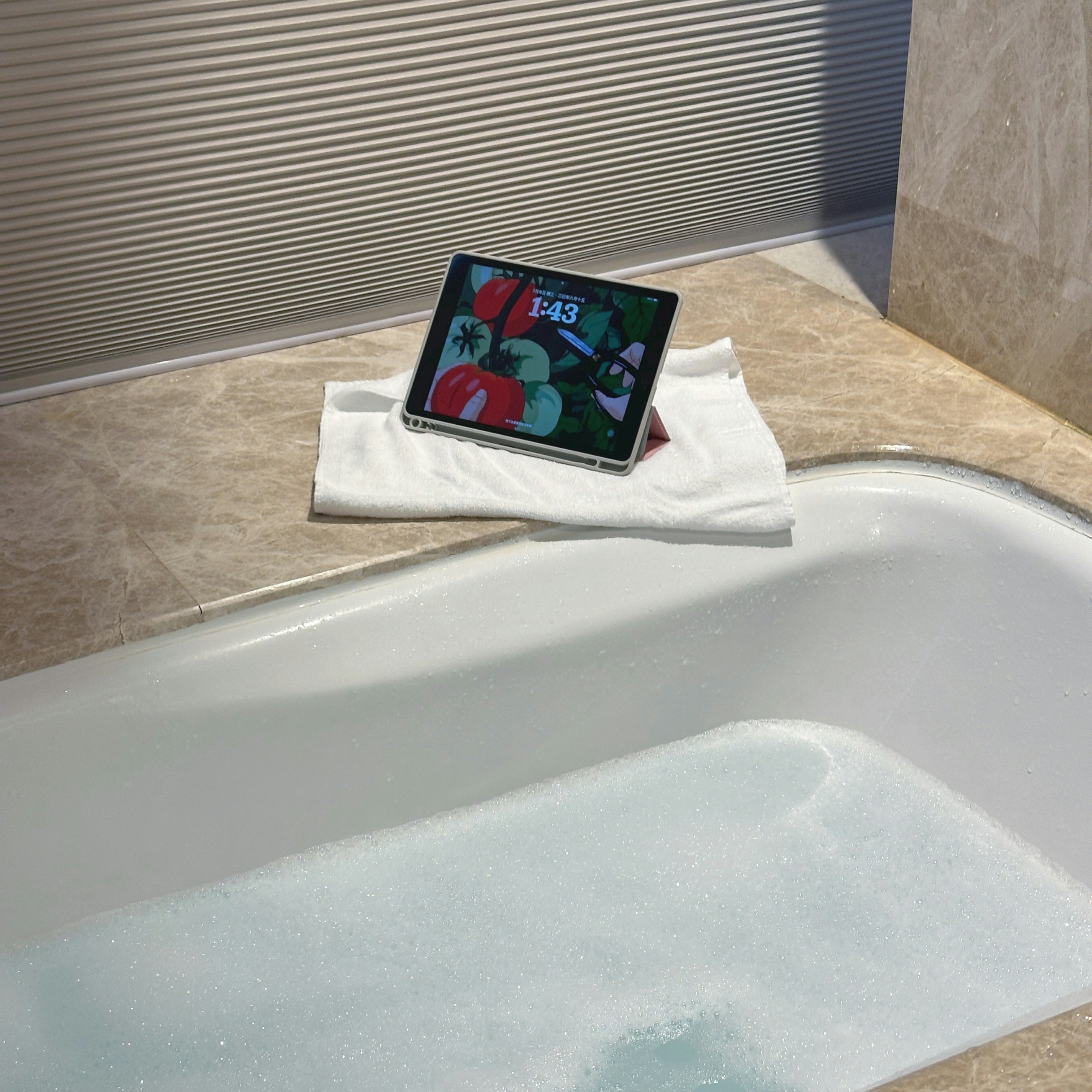 Tablet displaying colorful art on a bathtub tray photo – Free Bathroom ...