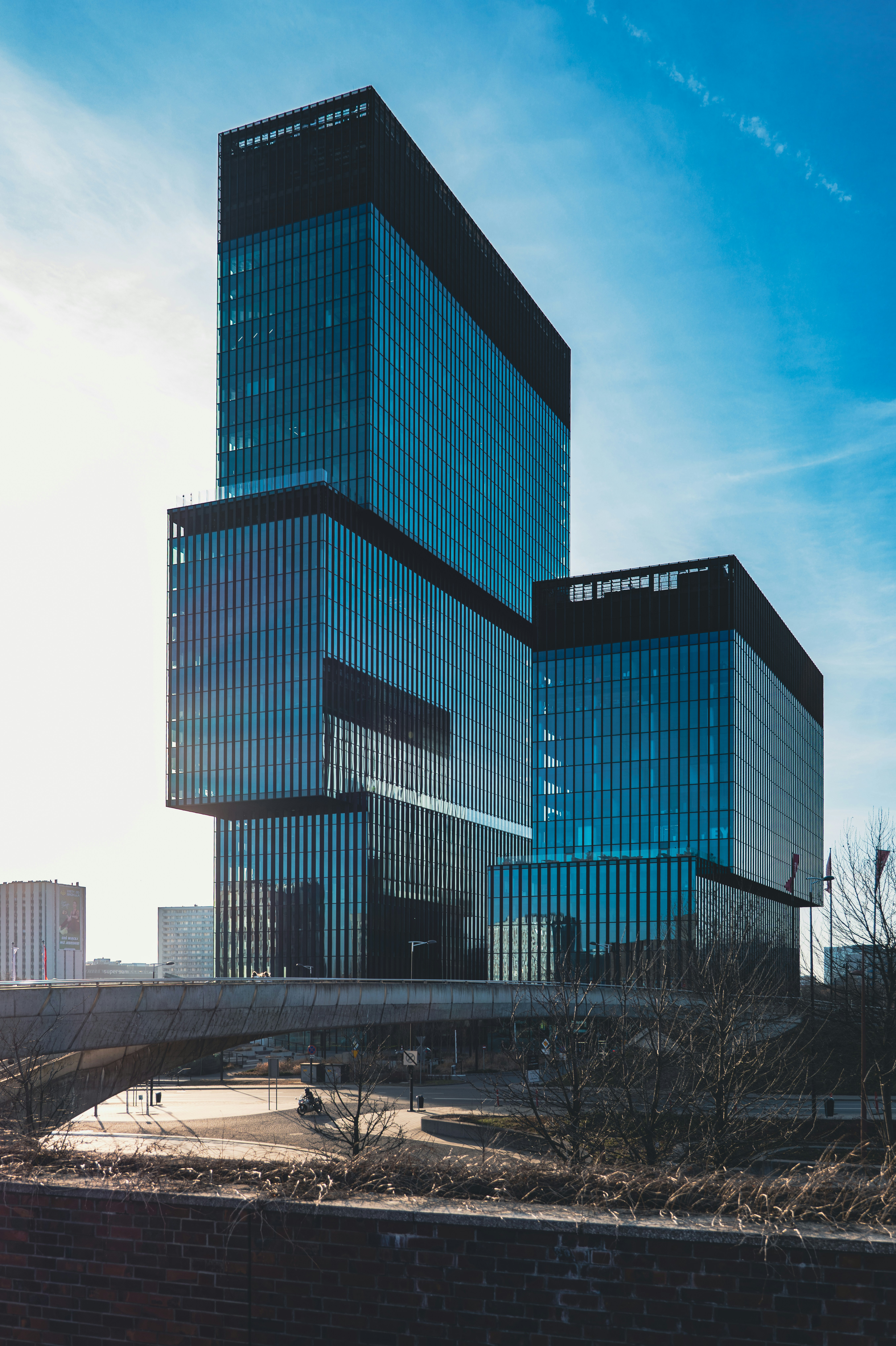 Glass Giants: A Stacked Cityscape Rising from the Rails