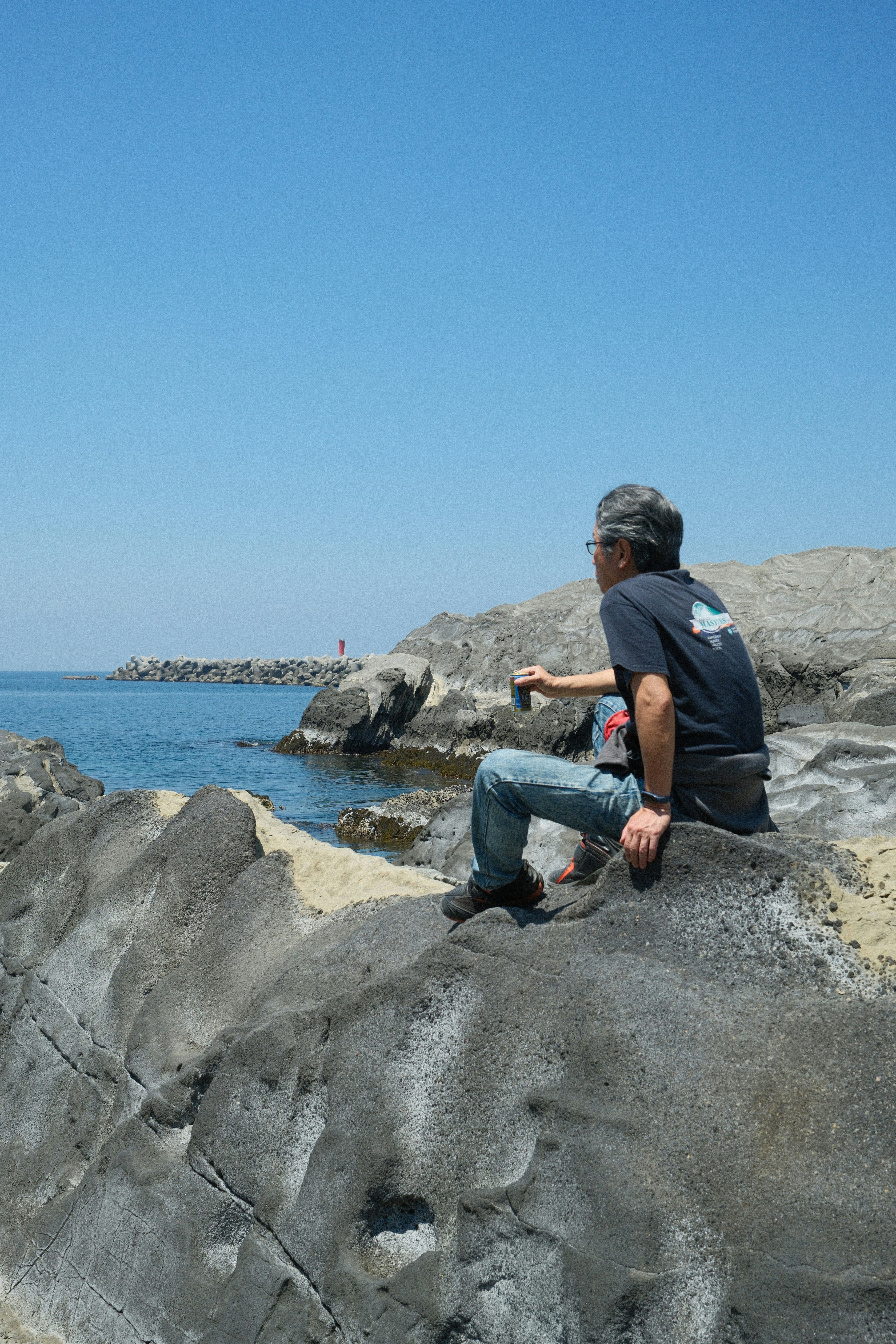 Seated on the Coast: A Quiet Moment with the Sea Breezes